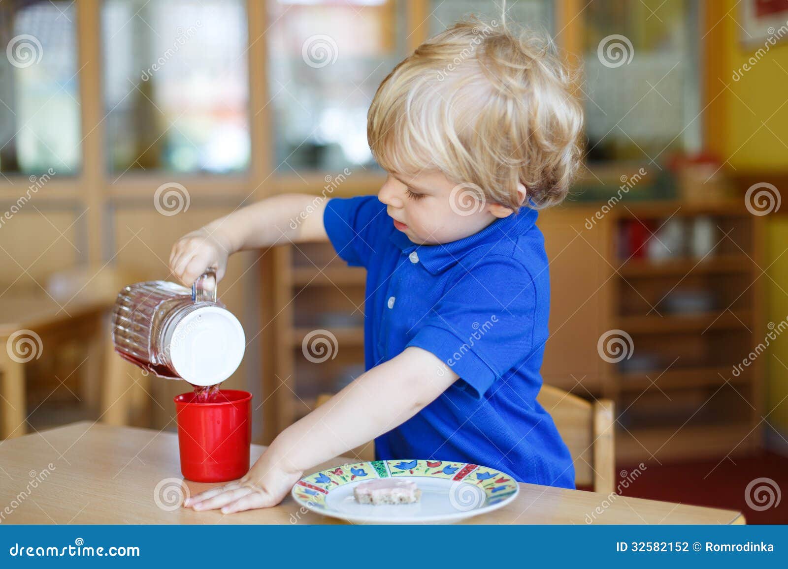 Little Boy of Two Years Having Breakfast at Nursery Stock Photo - Image ...