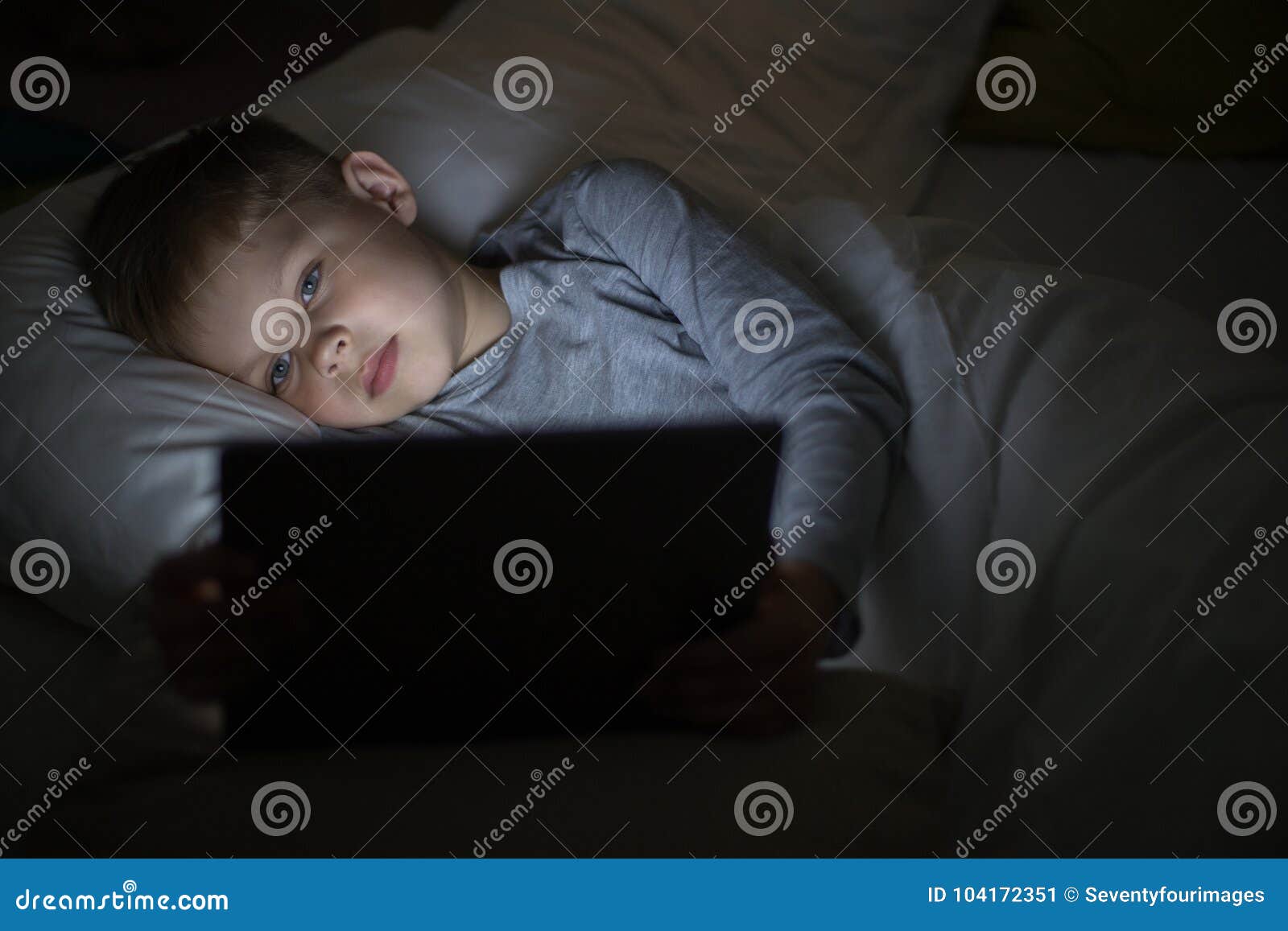 Little Boy Using Computer in Bed Stock Image - Image of cute, tablet ...