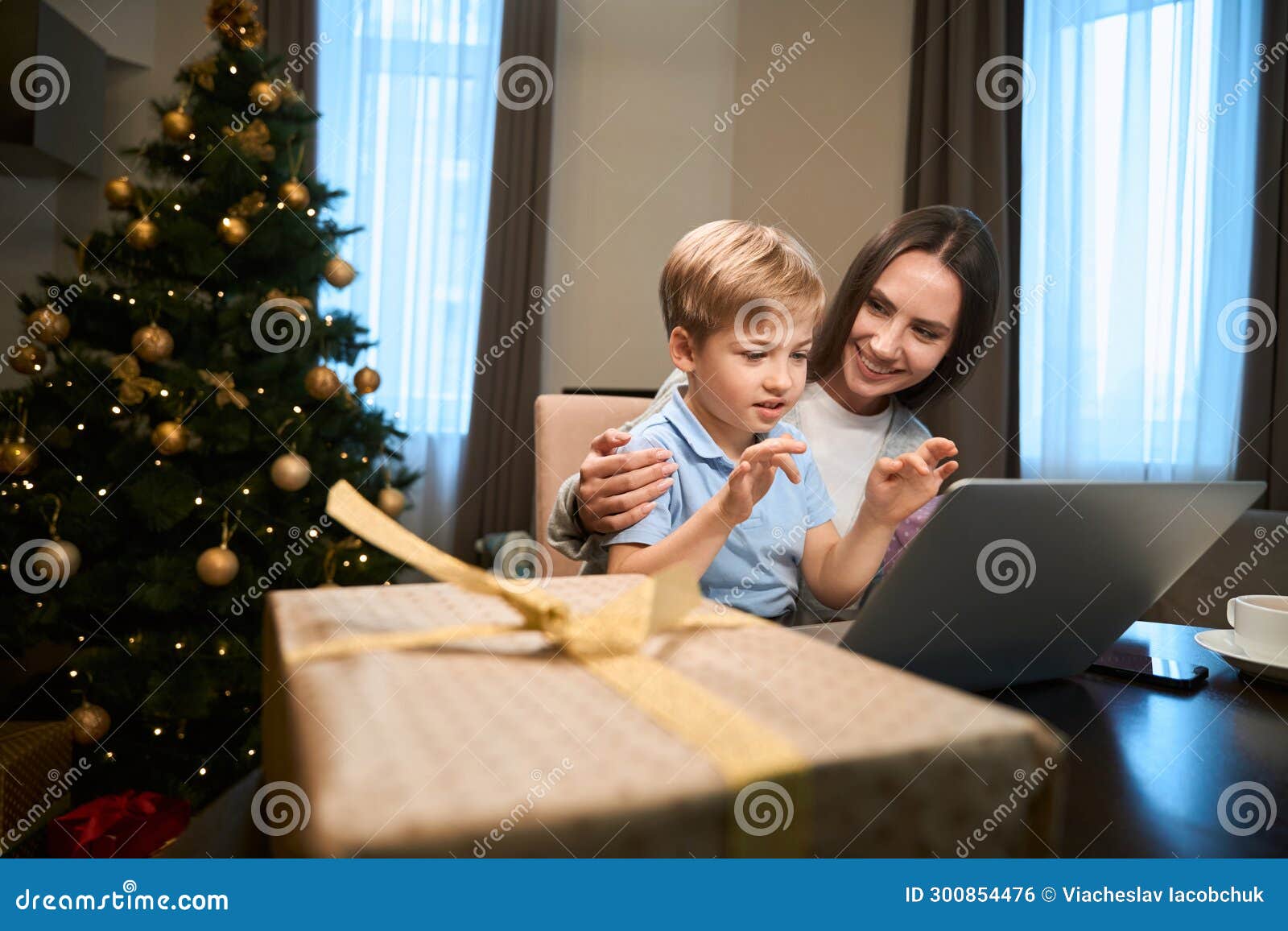 Little Boy Using Computer with Mother at Home during New Year ...