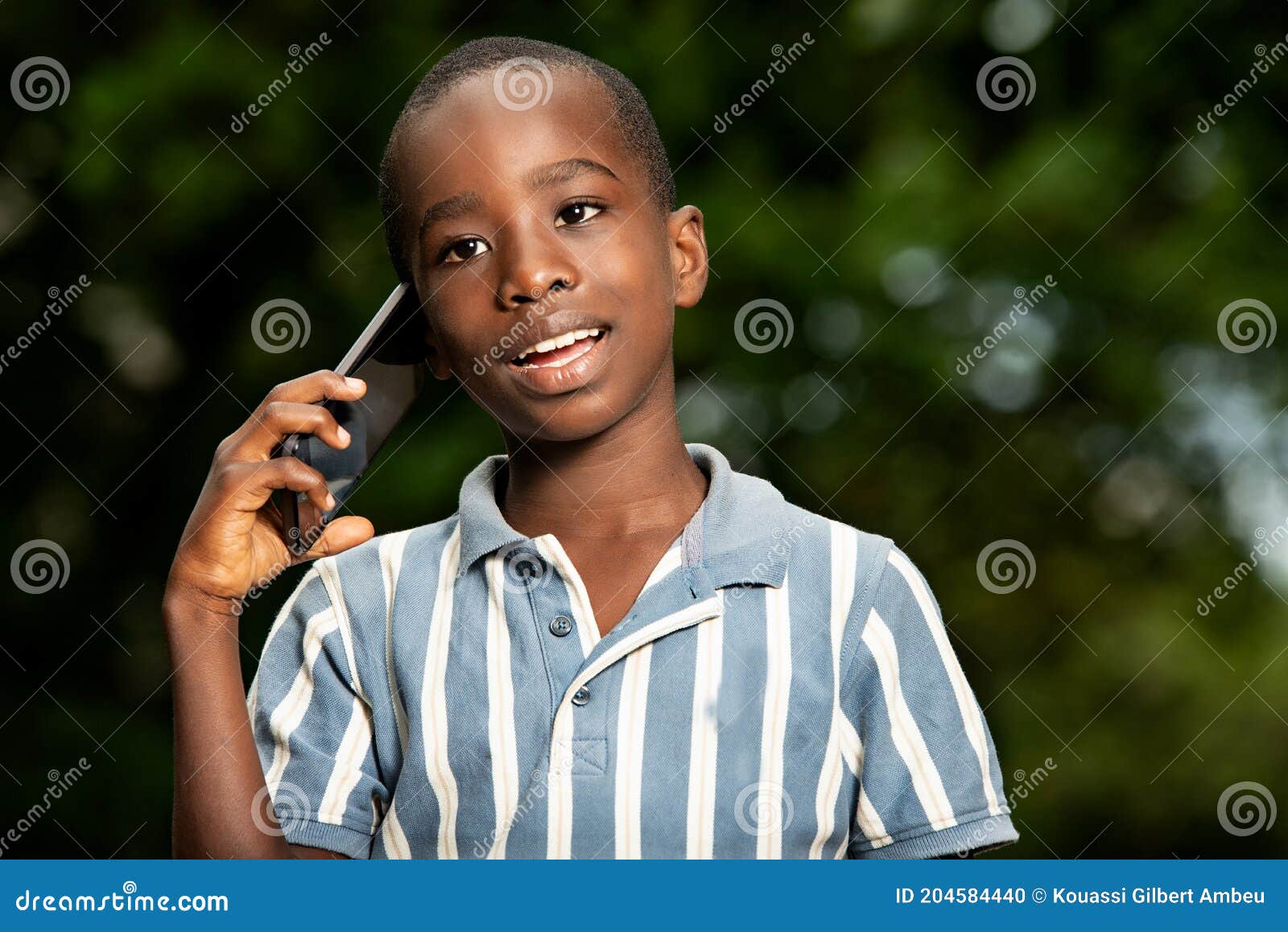 Little Boy Using a Mobile Phone Stock Photo - Image of city, male ...