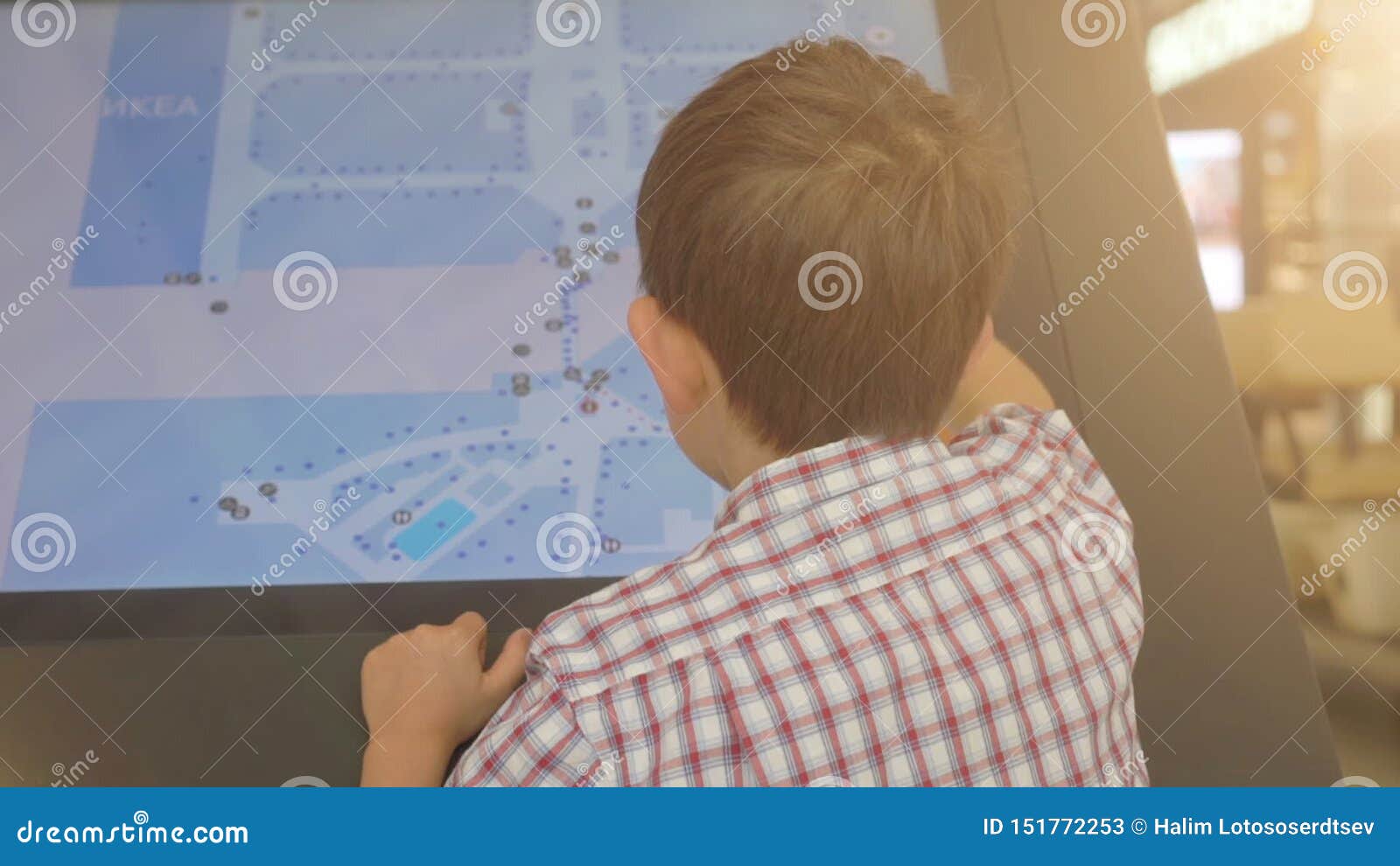 Little Boy Using a Touch Screen of Interactive Information Stand in the ...