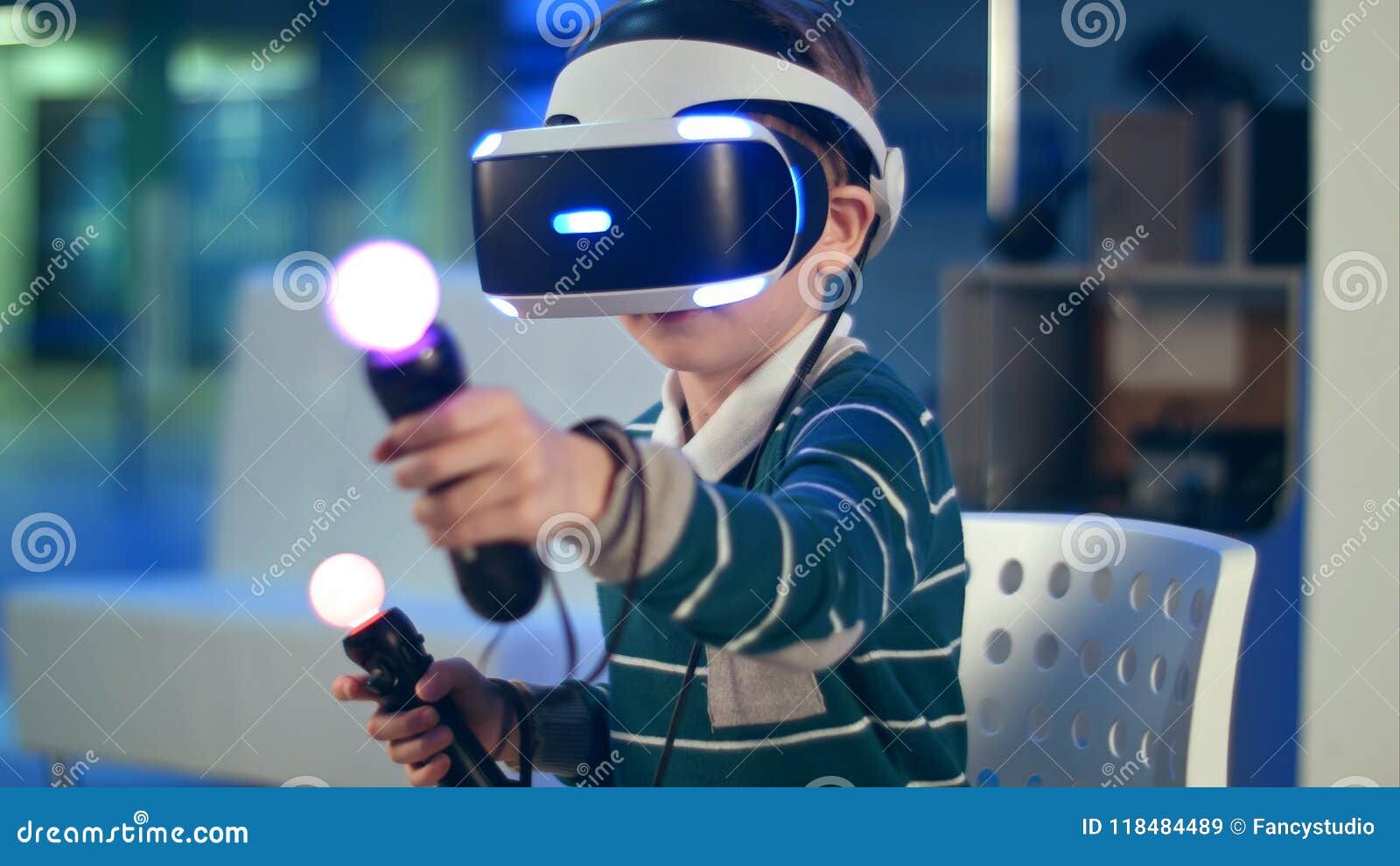 Little Boy with Virtual Reality Motion Controllers Having Immersive ... Little Boy with Virtual Reality Motion Controllers Having Immersive ...
