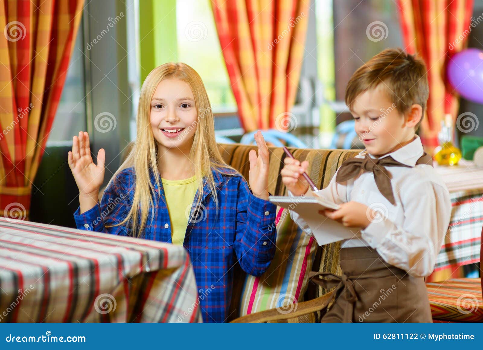 Little Boy Waiter Accepts the Order in a Cafe or Stock Photo - Image of ...
