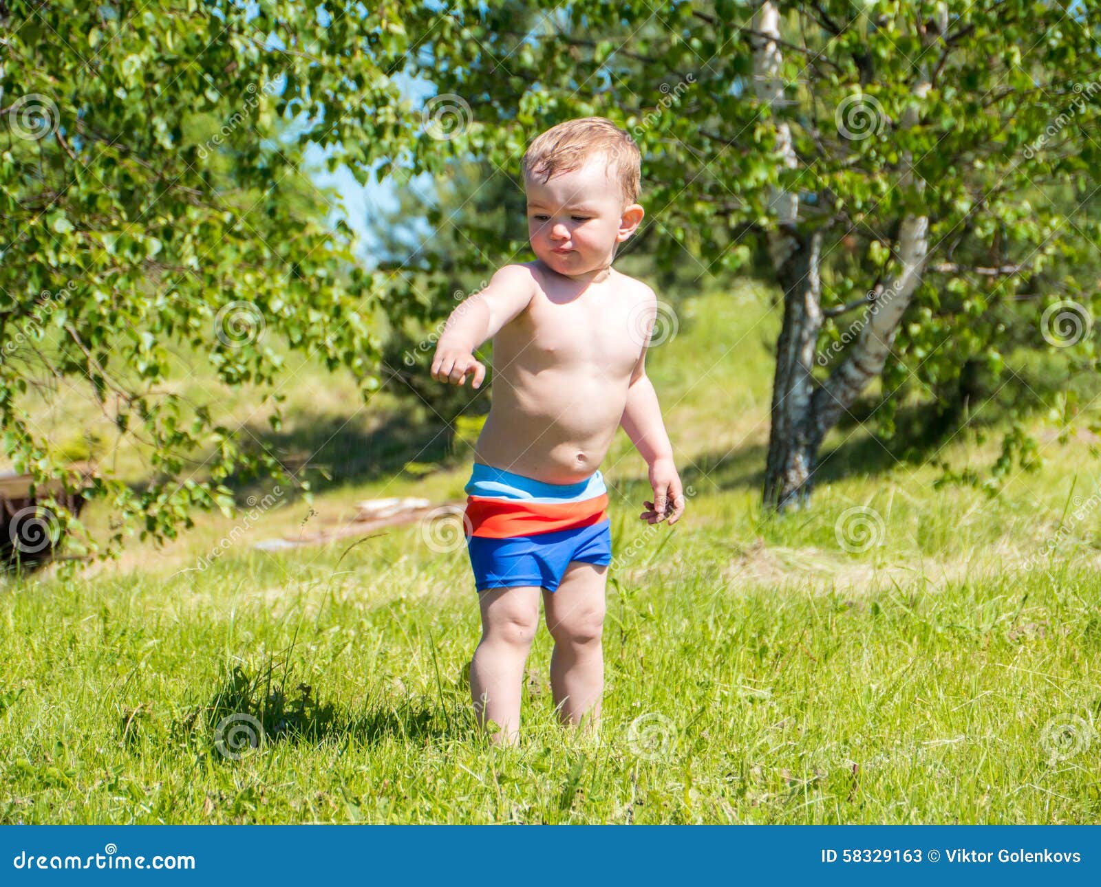 Little Boy Walking on a Green Grass Stock Image - Image of eyes ...