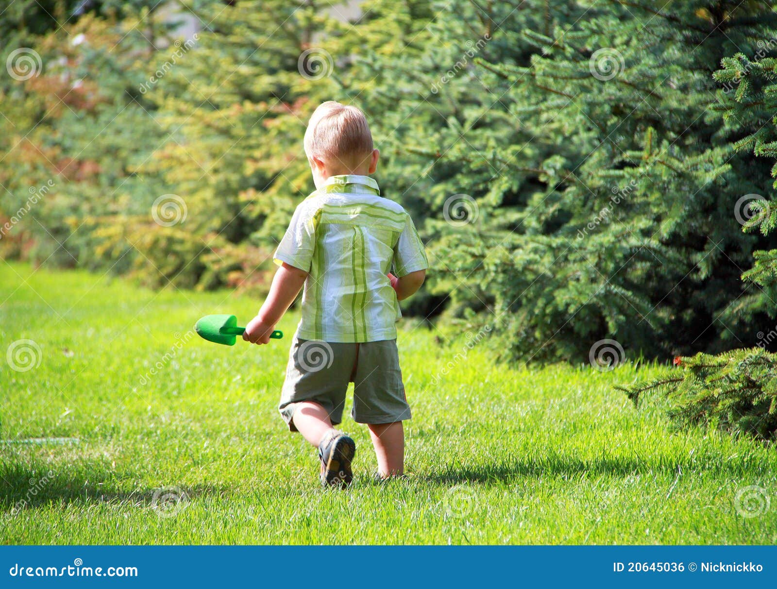 A Little Boy Walks in the Park Stock Photo - Image of park, little ...