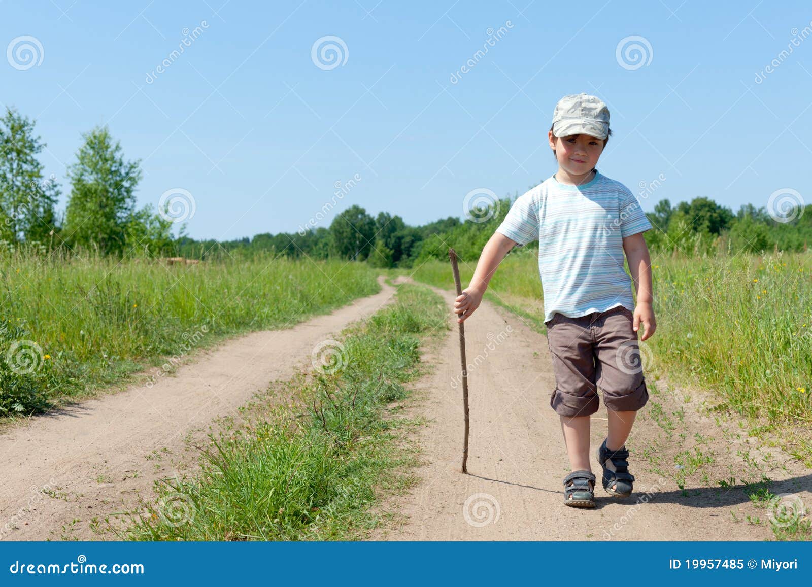 The Little Boy Walks on Rural Road Stock Image - Image of child, view ...