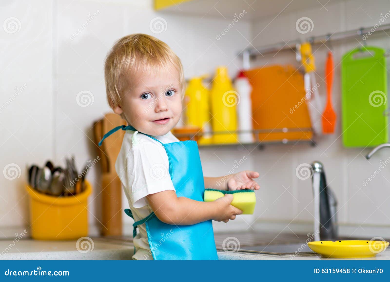 Little boy washing dishes stock photo. Image of household - 63159458