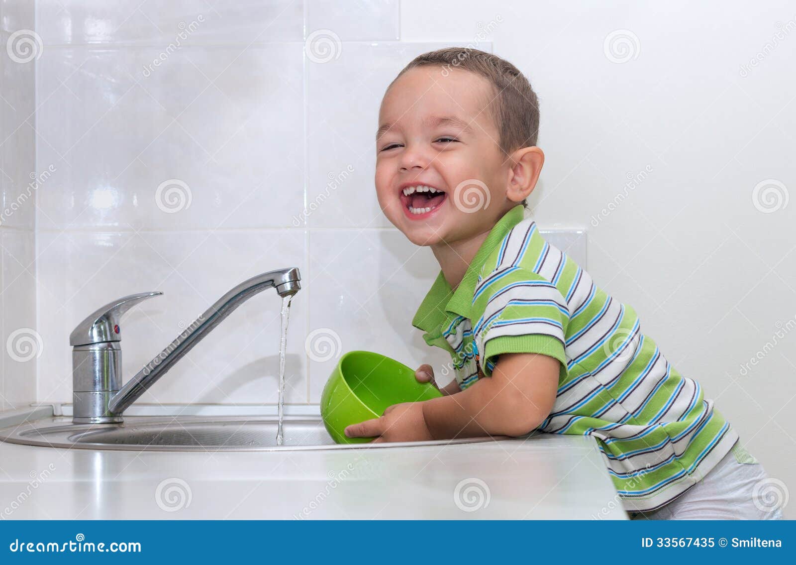 Little boy washing dishes stock image. Image of adorable - 33567435
