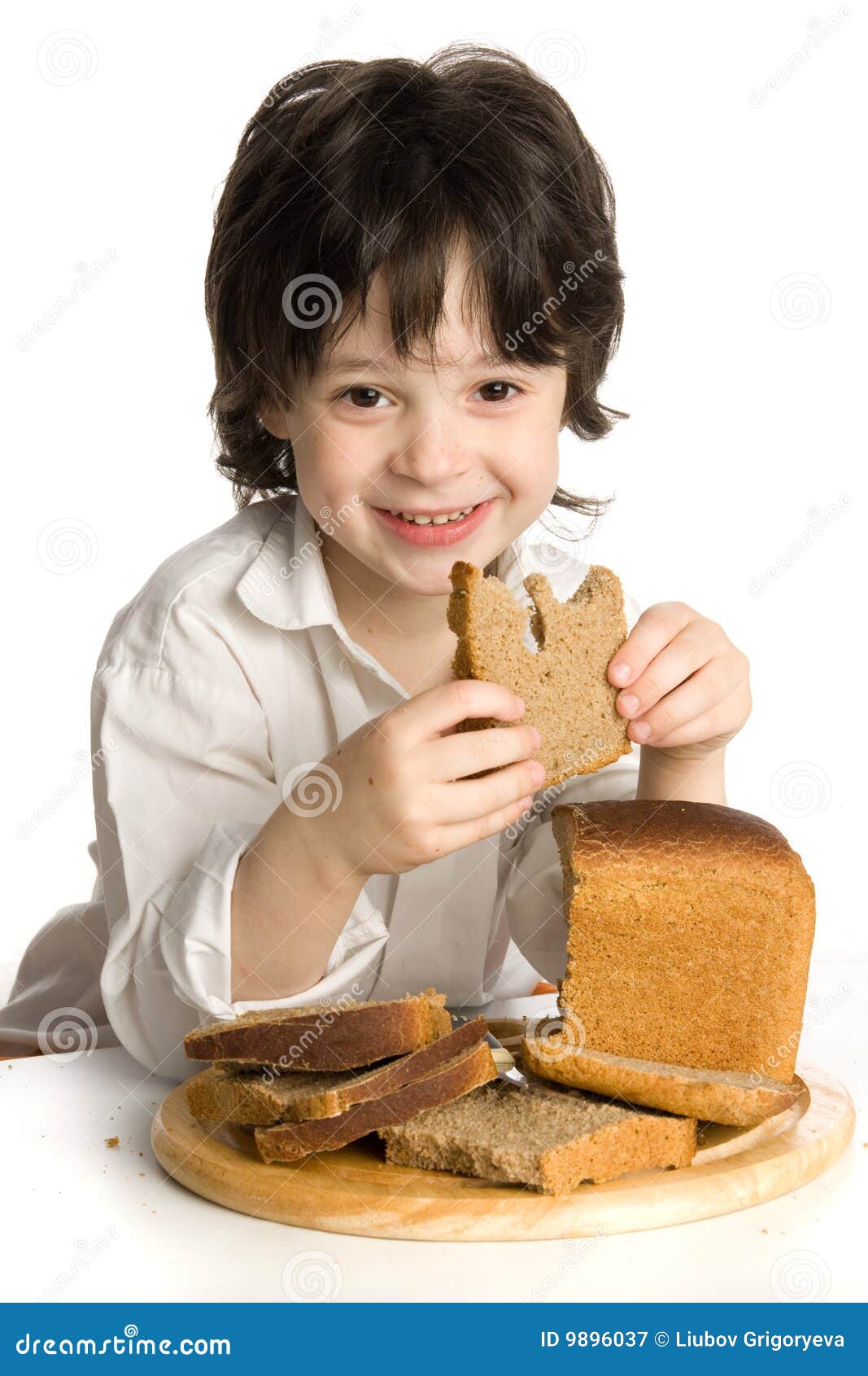 The Little Boy Which Eating a Bread on Desk Stock Image - Image of ...