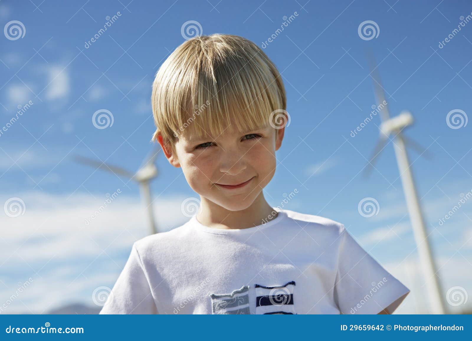 Little Boy with Wind Turbines in the Background Stock Photo - Image of ...