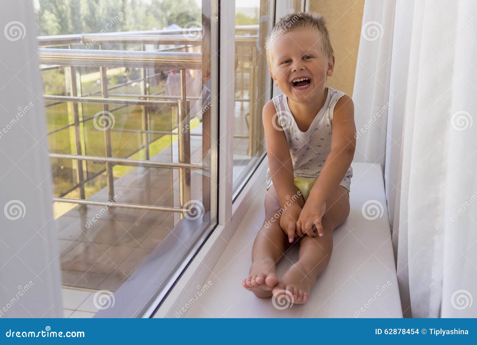 Little boy on the window stock photo. Image of fall, white - 62878454