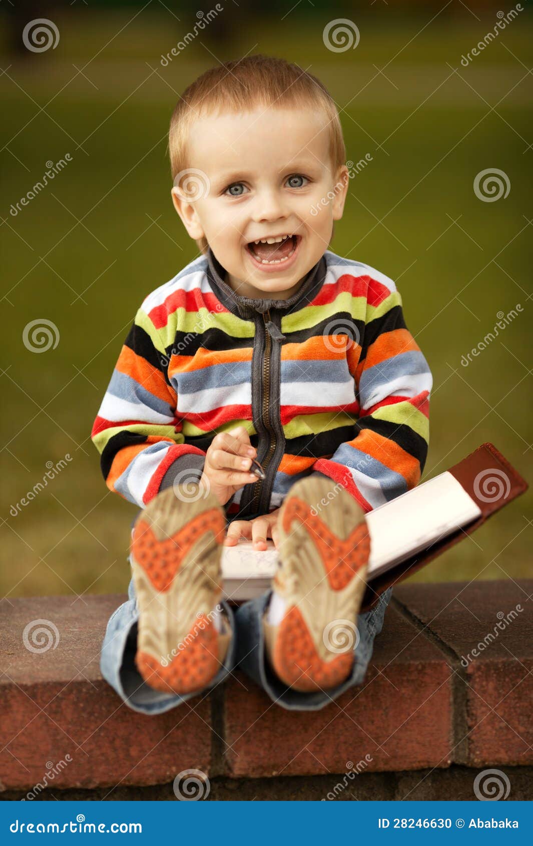 Little boy writes with pen stock photo. Image of notepad - 28246630