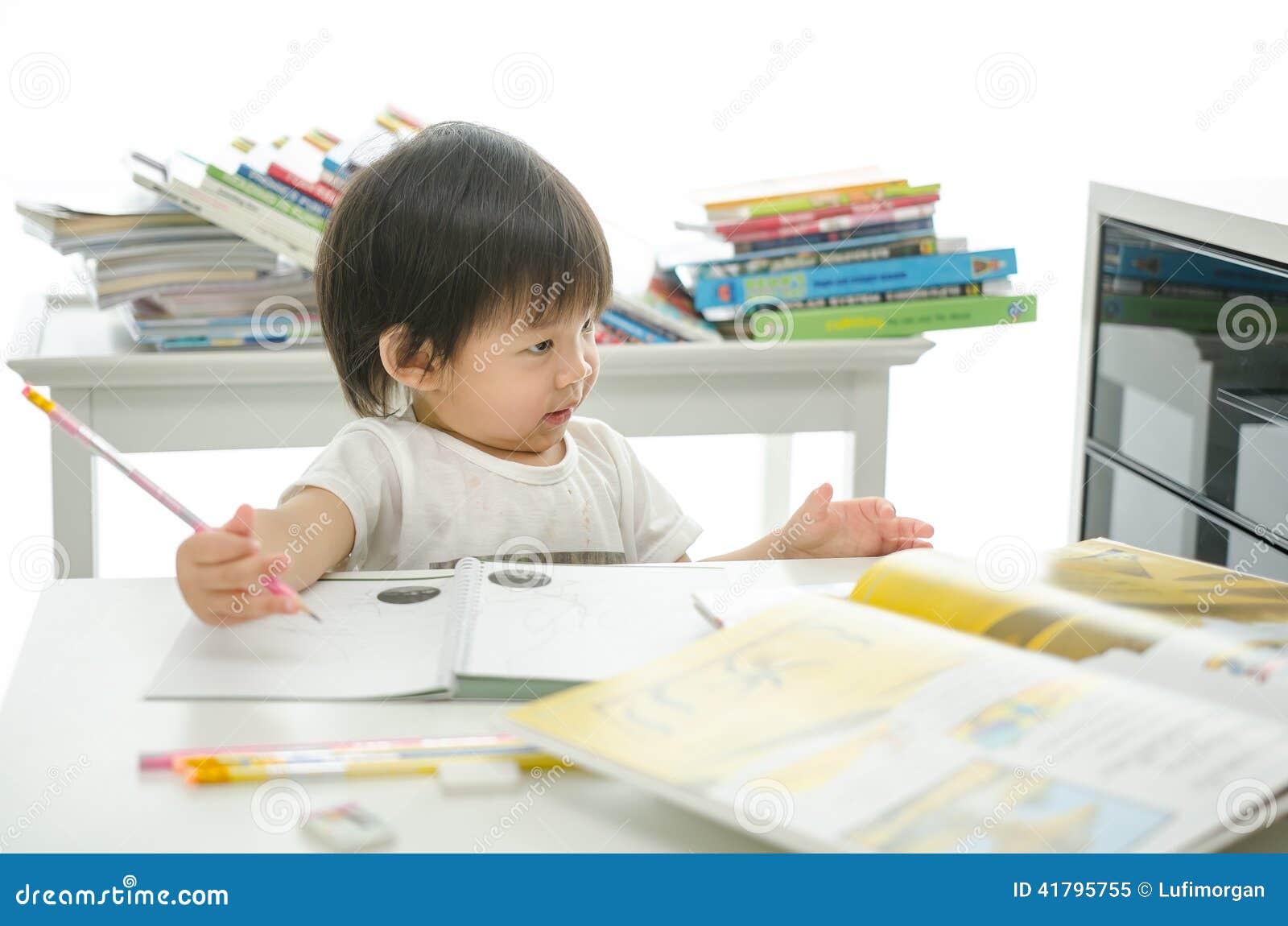 Little boy is writing stock image. Image of preschooler - 41795755