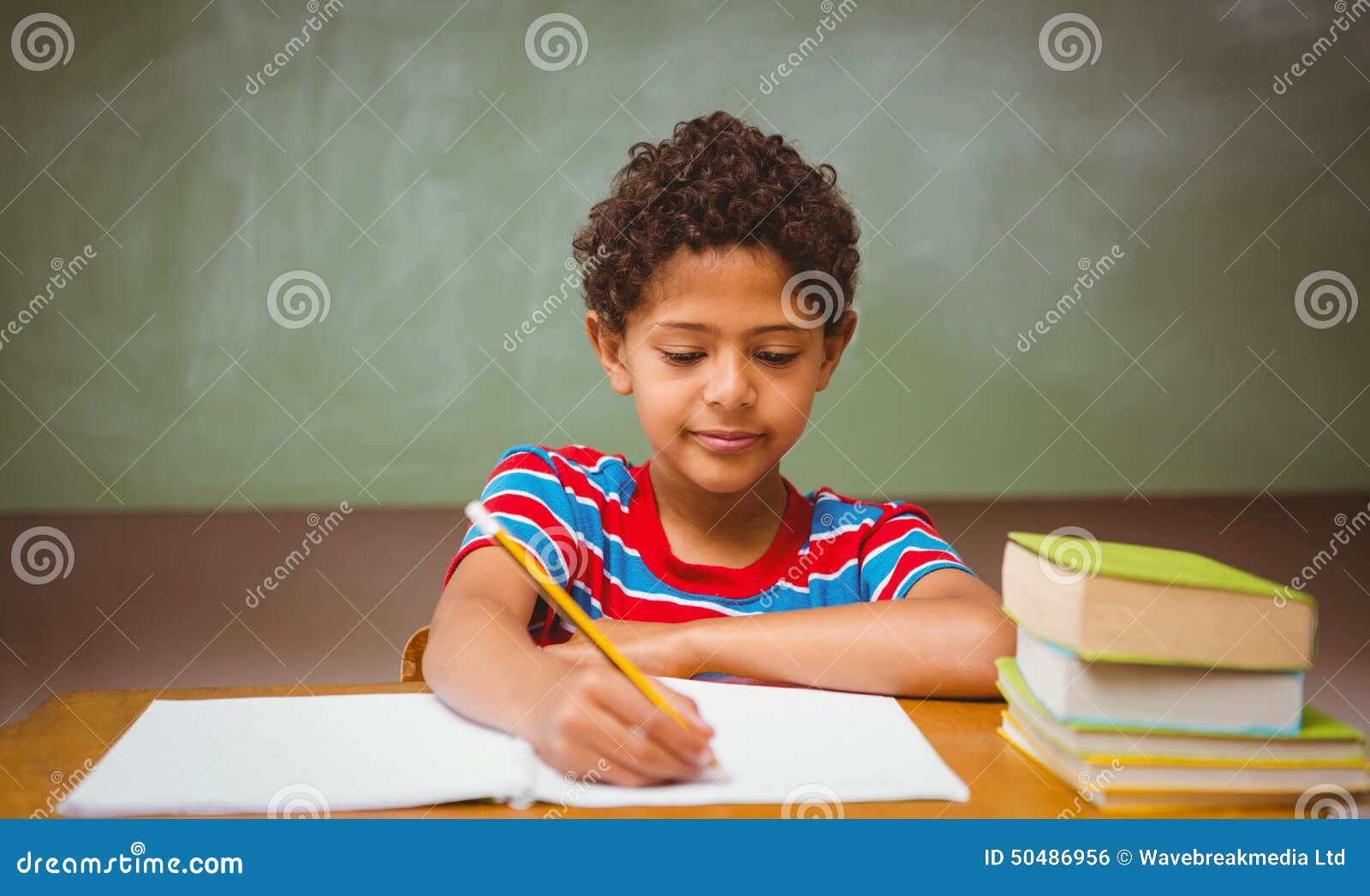 Little Boy Writing Book in Classroom Stock Photo - Image of cute ...