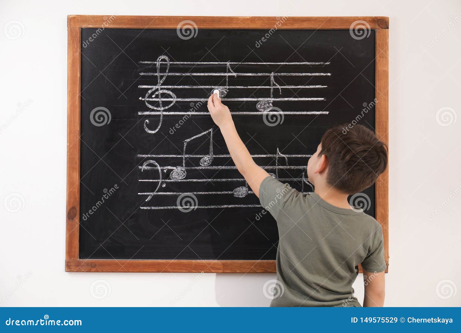 Little Boy Writing Music Notes on Blackboard Stock Image - Image of ...