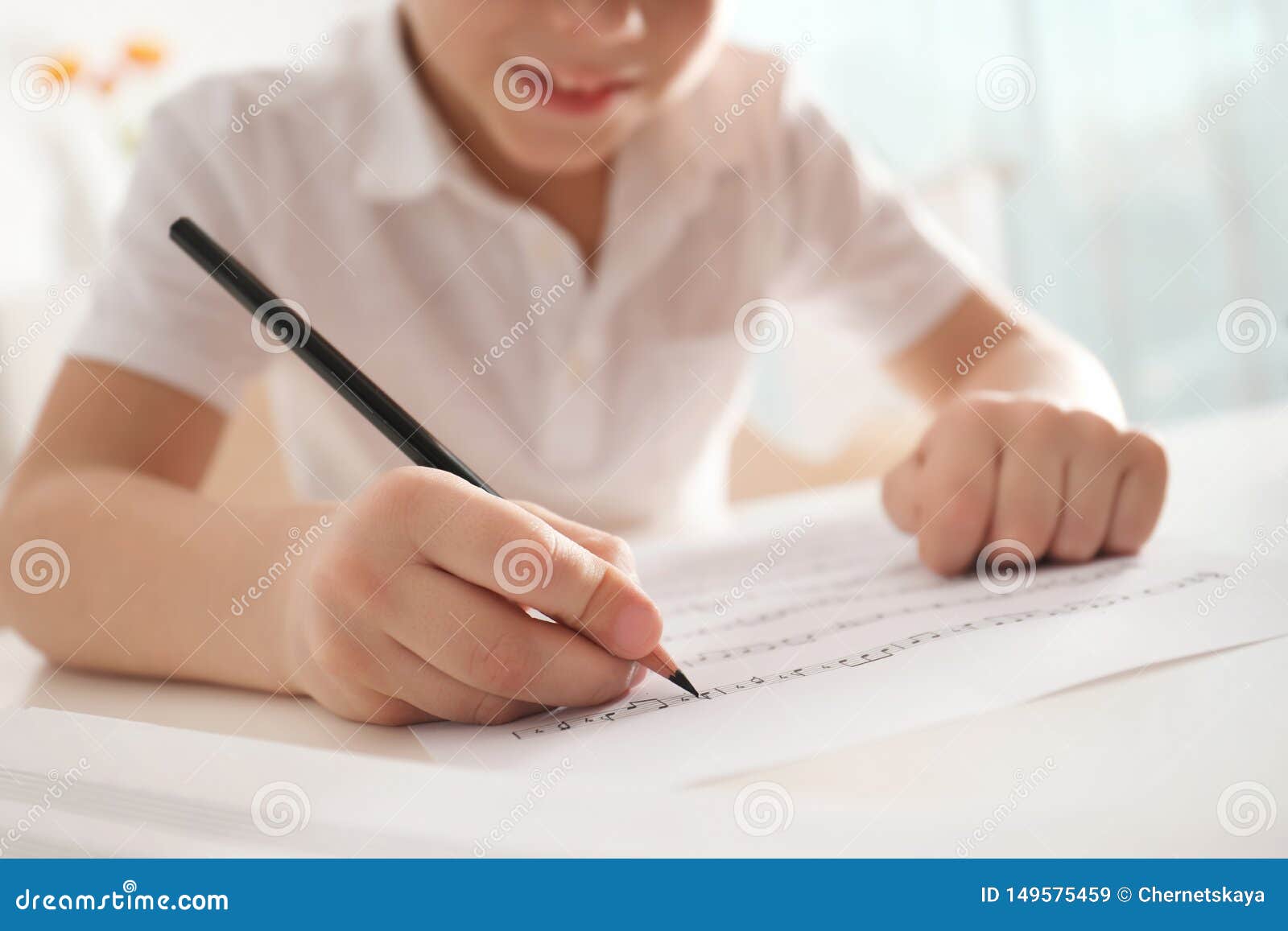 Little Boy Writing Music Notes at Table Stock Image - Image of learning ...