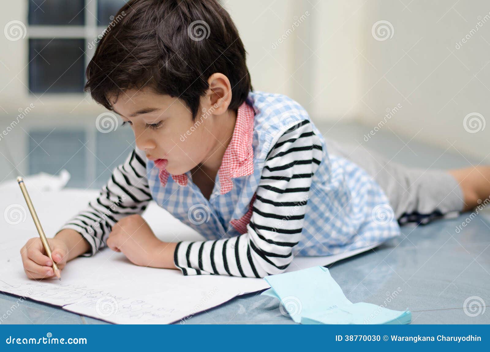 Little Boy Writing White Paper On The Floor Stock Photo - Image: 38770030
