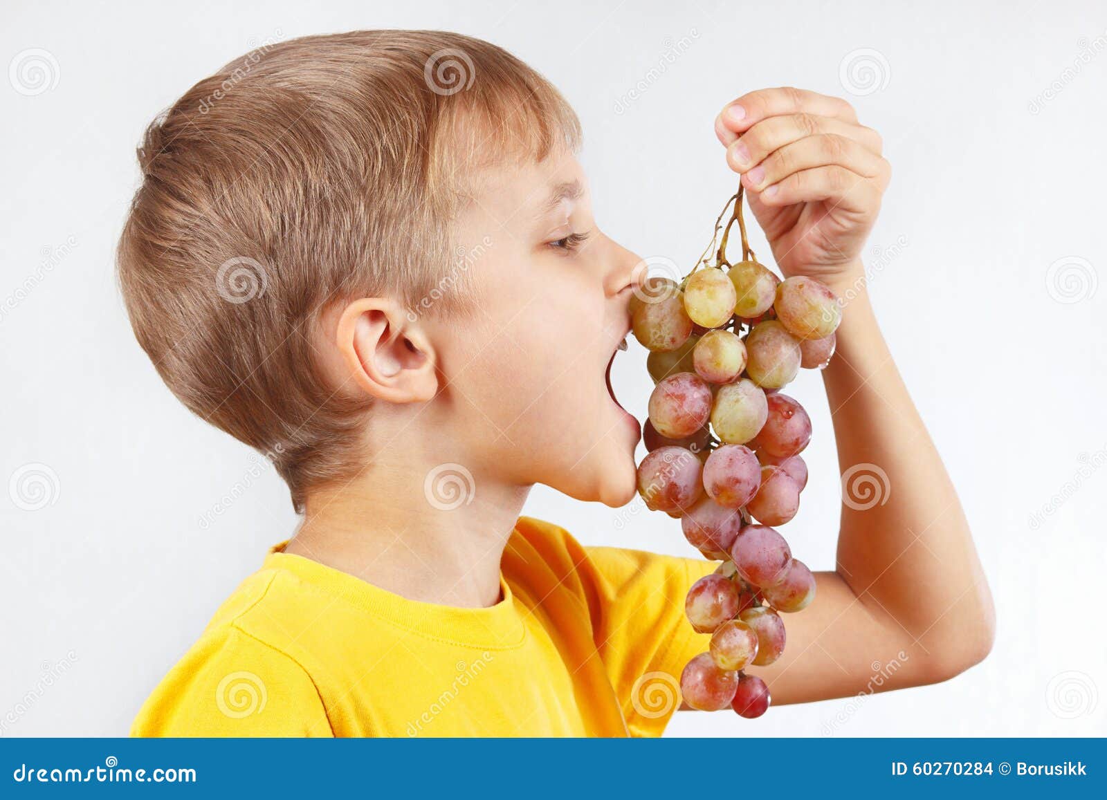 Little Boy in a Yellow Shirt Eating Grape Stock Photo - Image of fresh ...