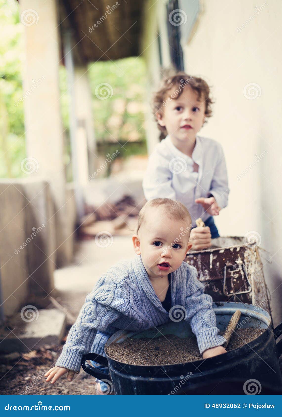 Little Boys Playing Outside the House Stock Photo - Image of person ...