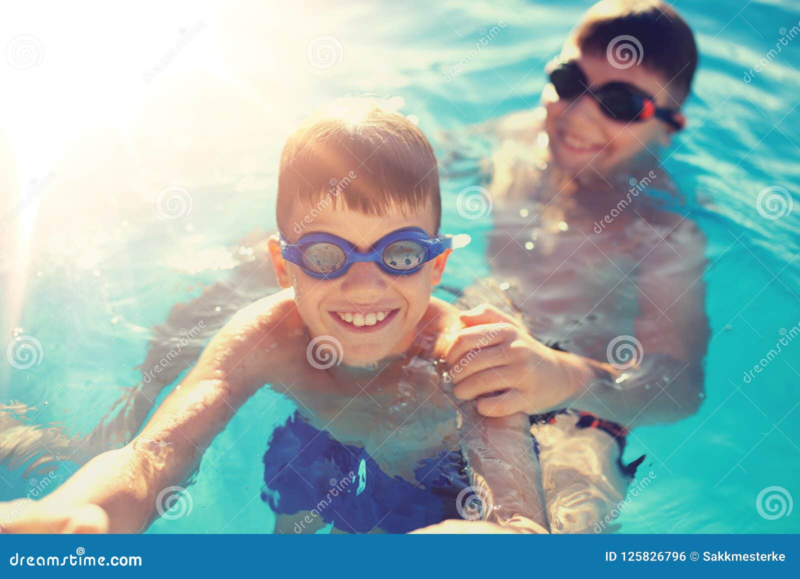 Little Boys Playing in Swimming Pool Stock Photo - Image of holding ...