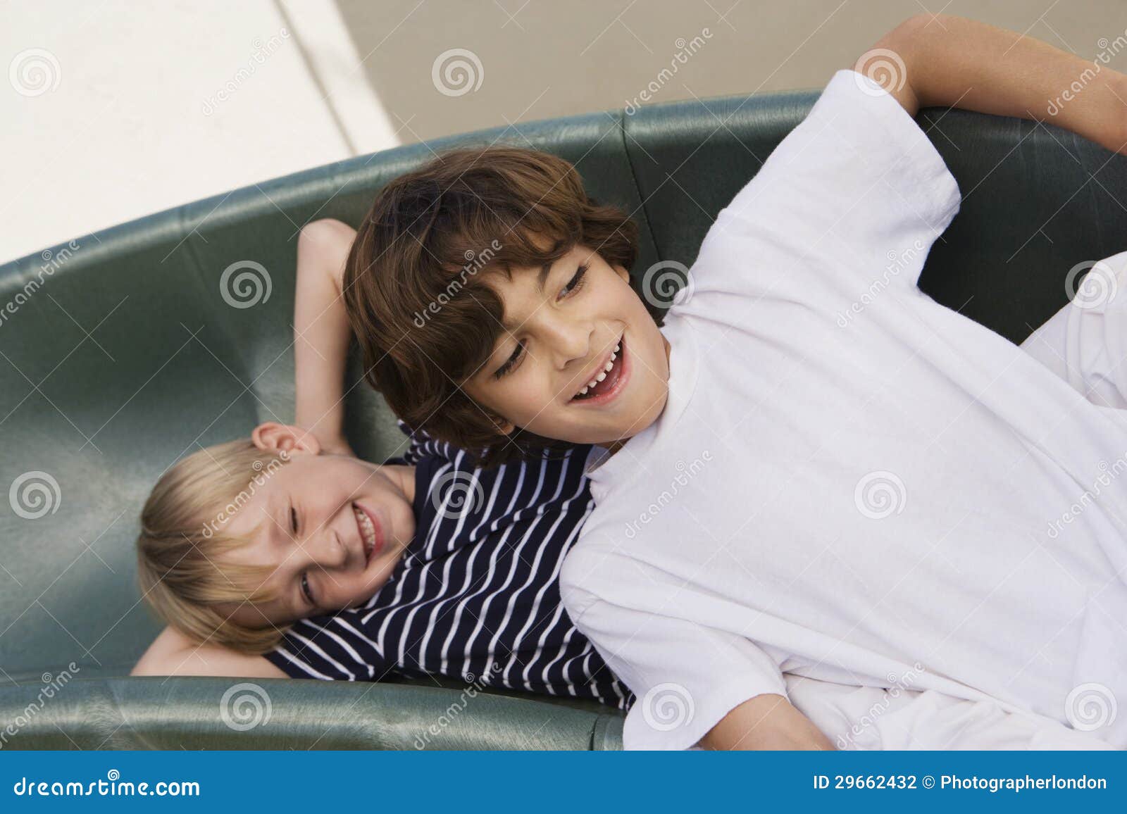 Little Boys Sliding Down a Slide Stock Photo - Image of enjoying ...