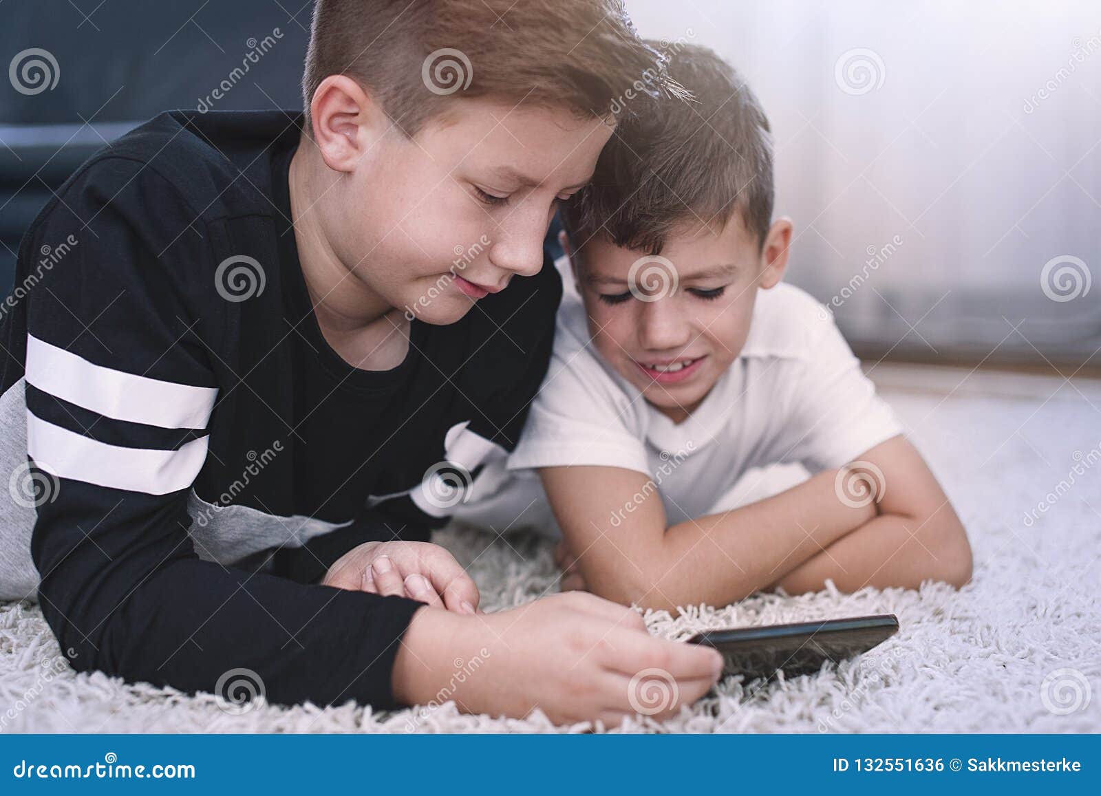 Little Boys Using Smartphone on Carpet Stock Photo - Image of ...