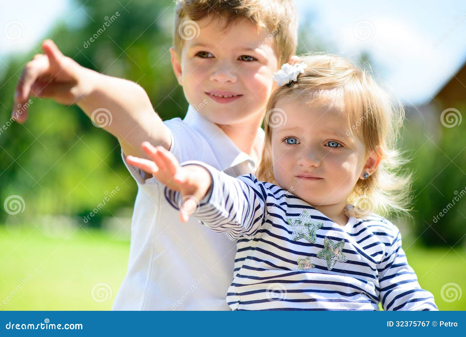 Little Brother and Sisiter Pointing Stock Image - Image of green ...