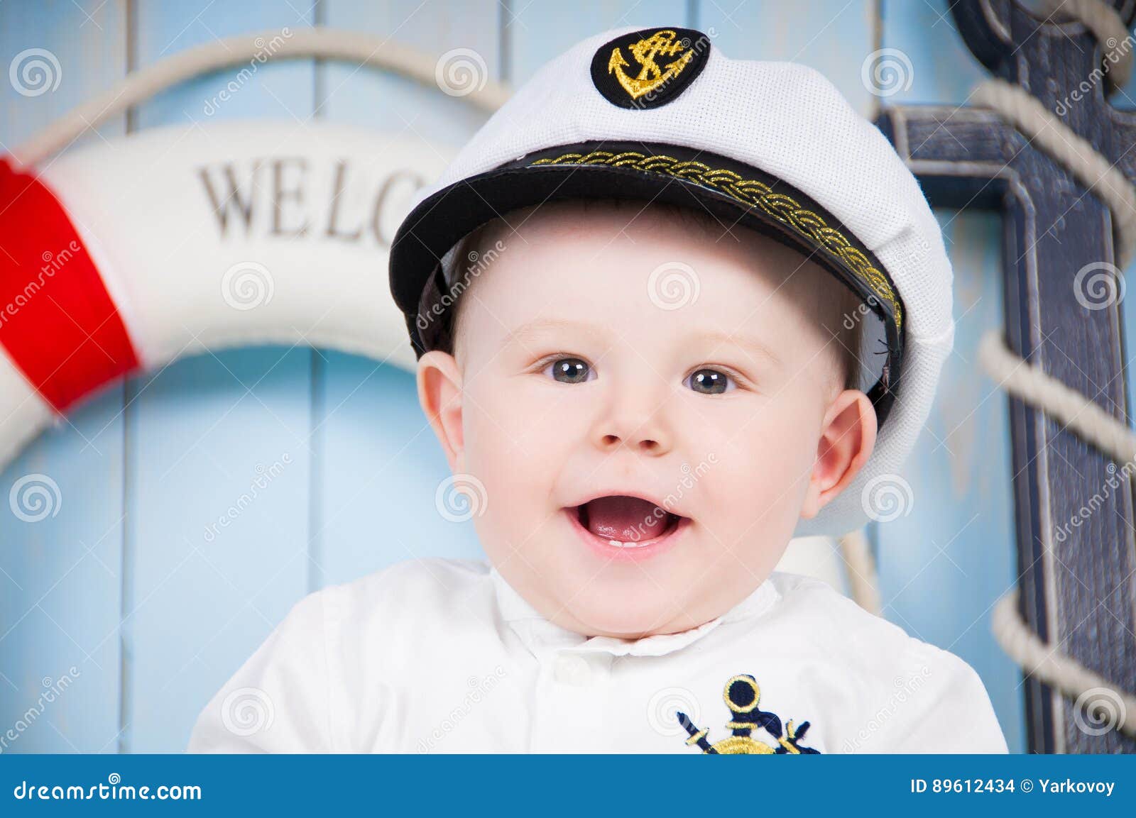 A Little Cheerful Boy Captain in the Maritime Interior Stock Photo ...
