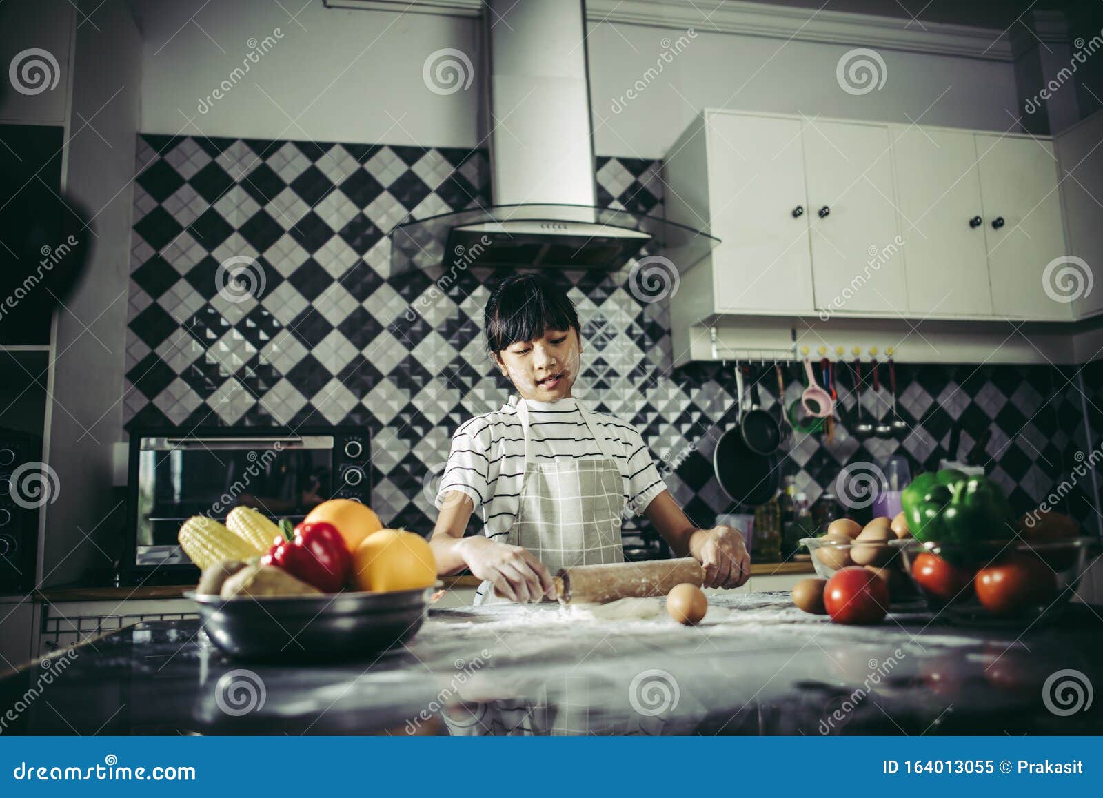 Little Chef Using Rolling Pin Stretching the Dough. Stock Image - Image ...