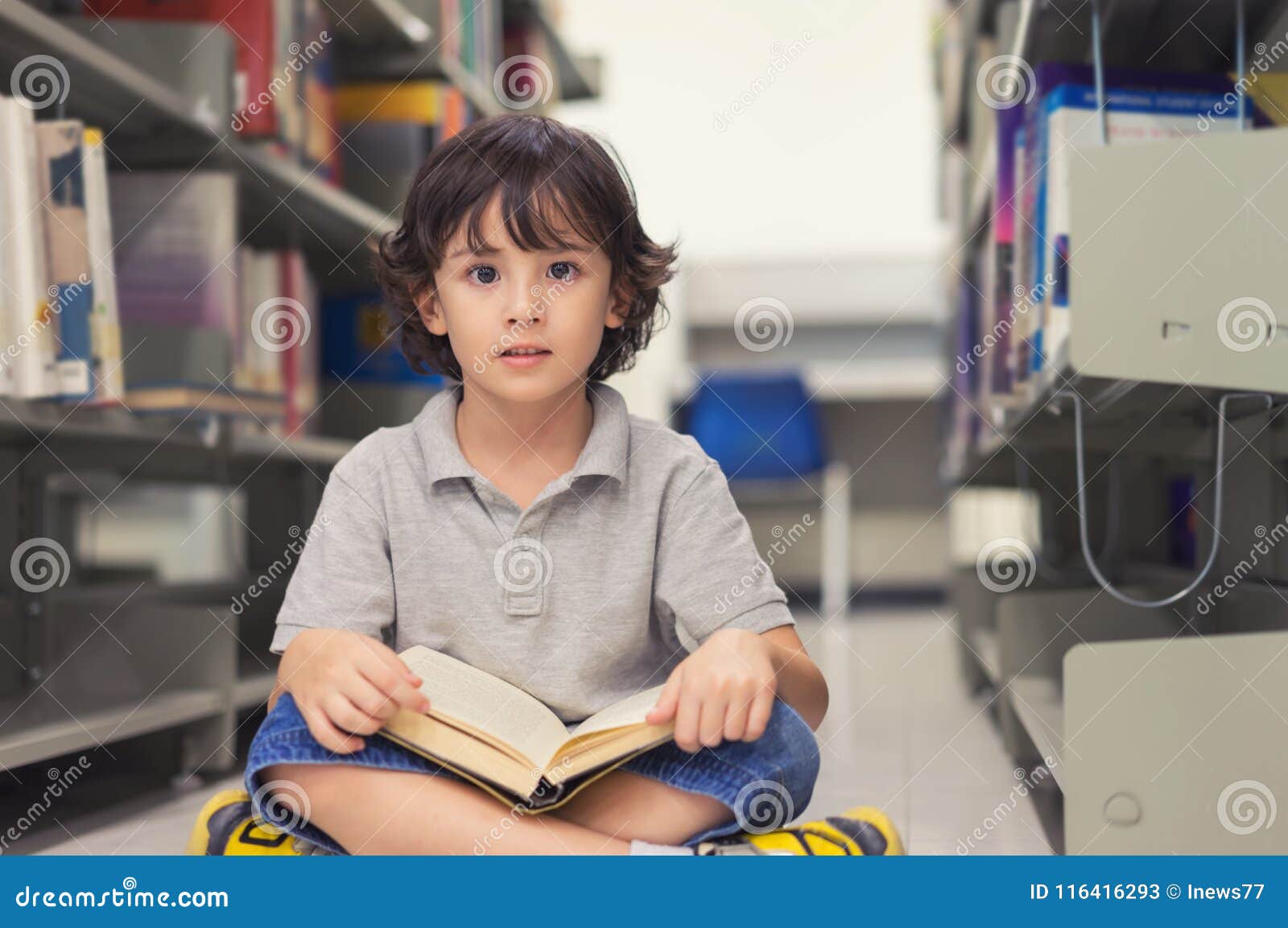 Little Child Boy Reading a Book in Library. Stock Image - Image of ...