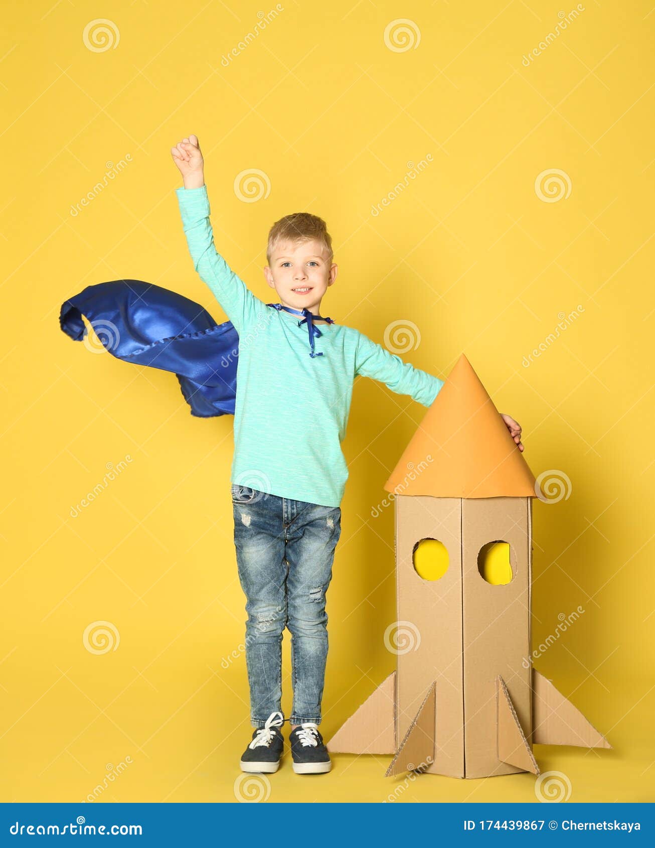 Little Child in Cape Playing with Rocket Made of Cardboard Box on ...