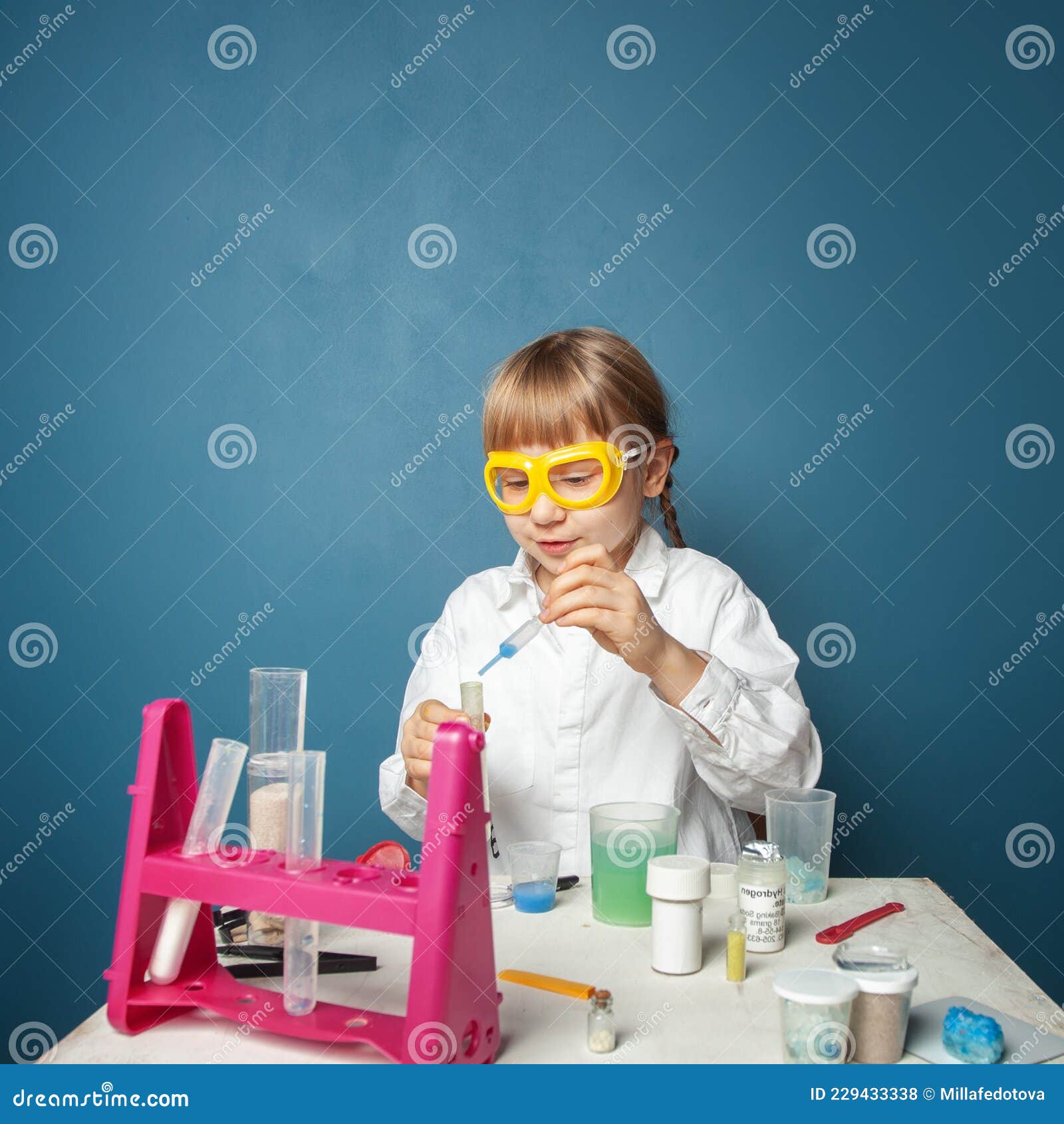 Little Child Girl Doing a Chemistry Experiment in Science Class Stock ...