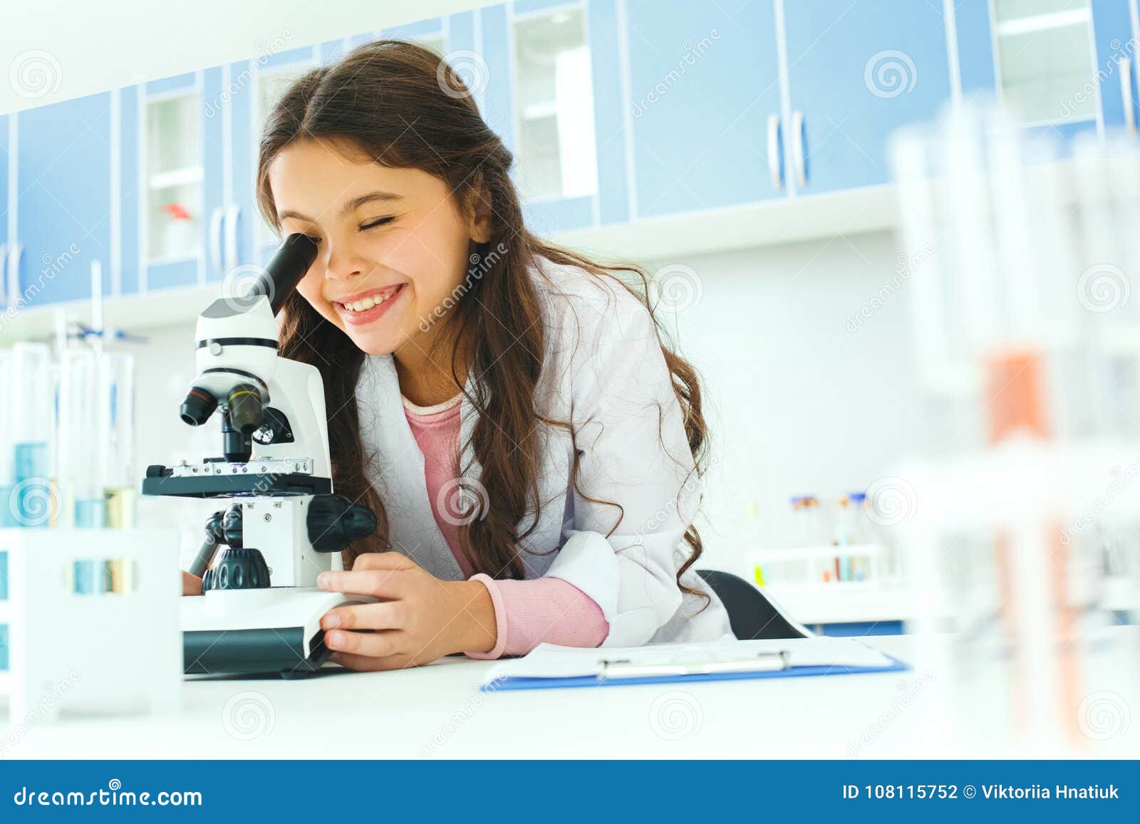 Little Child with Learning Class in School Laboratory Using Microscope ...