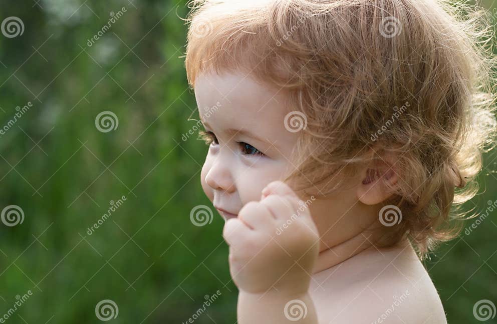 Little Child Play in Park. Portrait of a Happy Baby in Grass Field ... Little Child Play in Park. Portrait of a Happy Baby in Grass Field ...