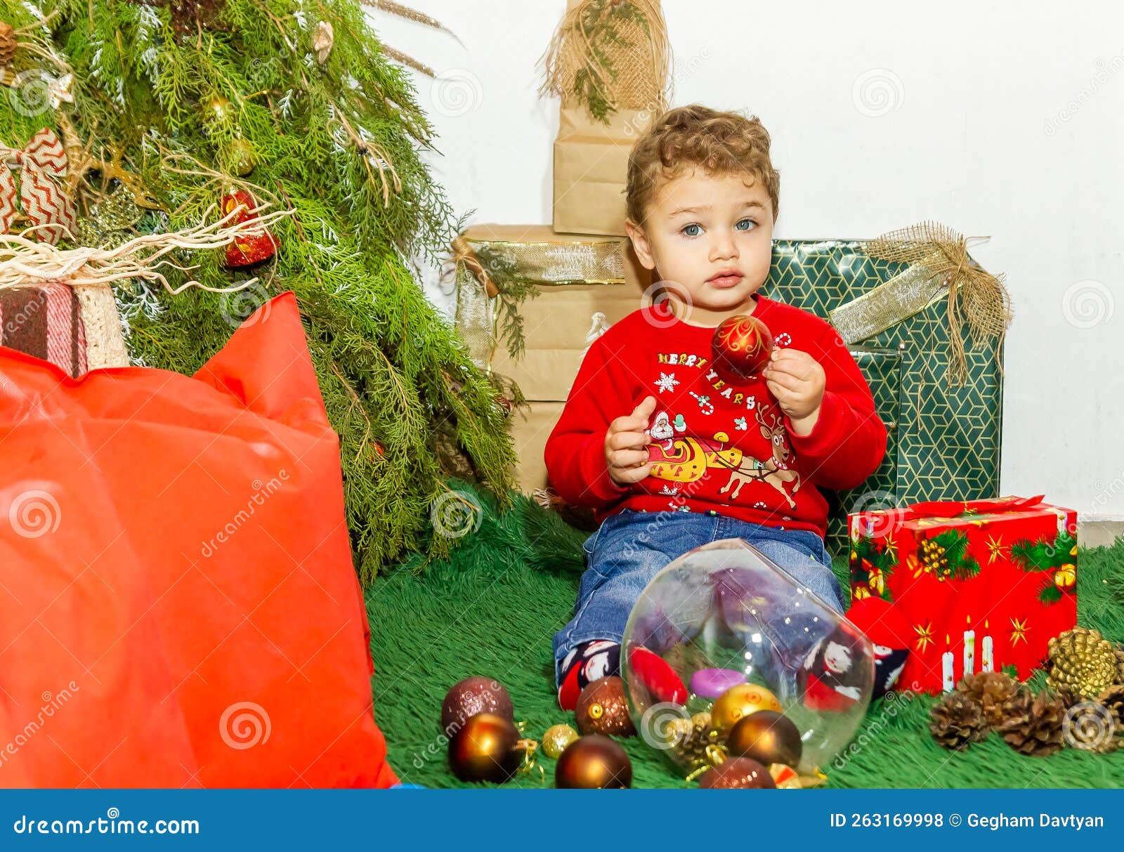 Little Child Playing with Christmas Decorations in Studio, Little Child ...