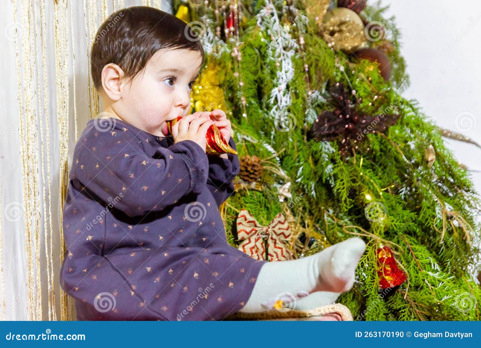 Little Child Playing with Christmas Decorations in Studio, Little Child ...