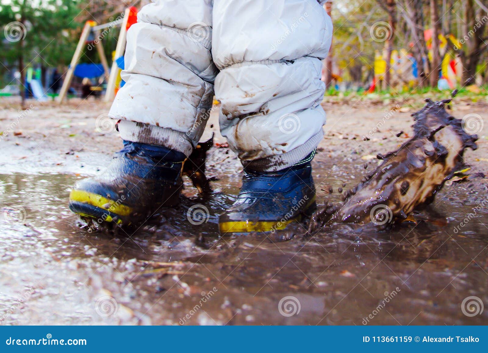 Little Kid Jumping in a Puddle in the Park Stock Image - Image of ...