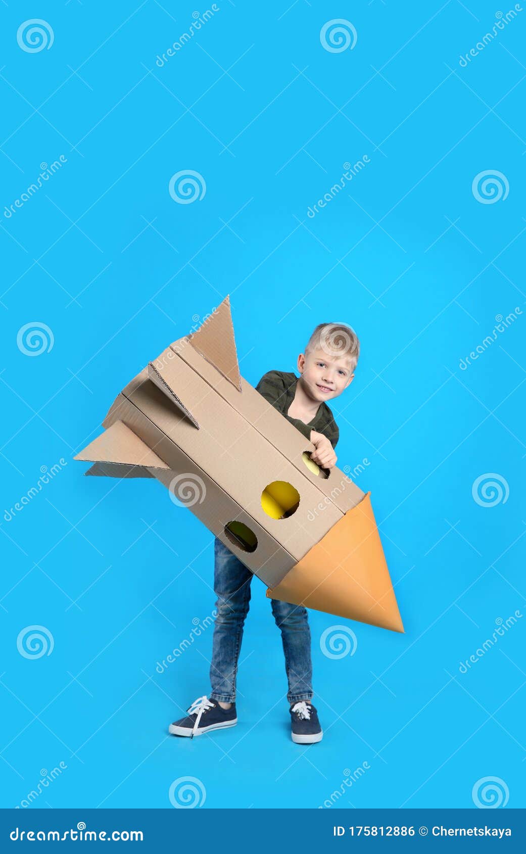 Little Child Playing with Rocket Made of Cardboard Box on Blue ...