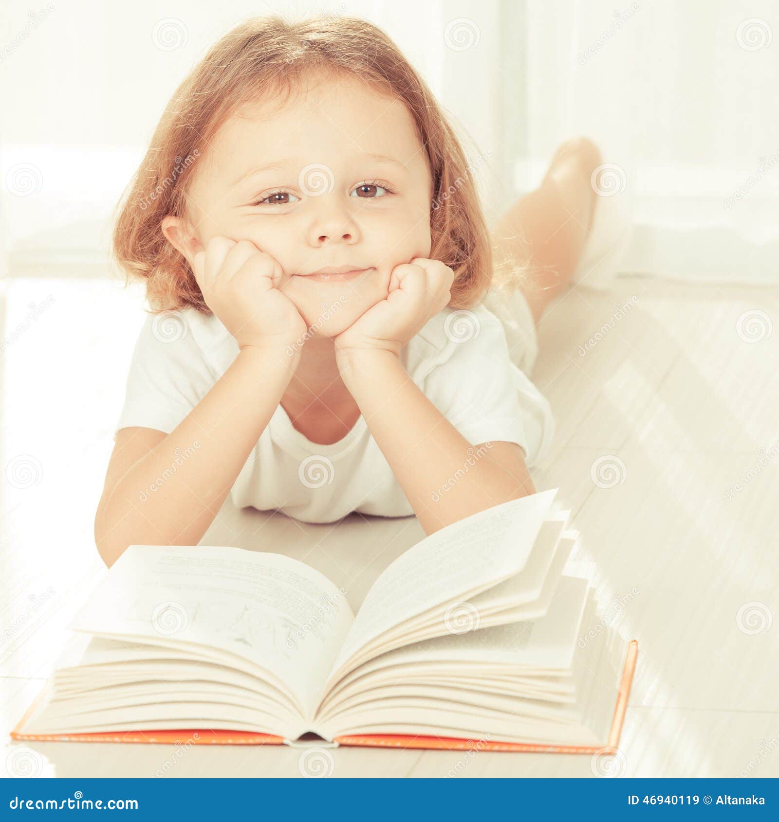 Little Child Reading Book Lying Down Stock Image - Image of learning ...
