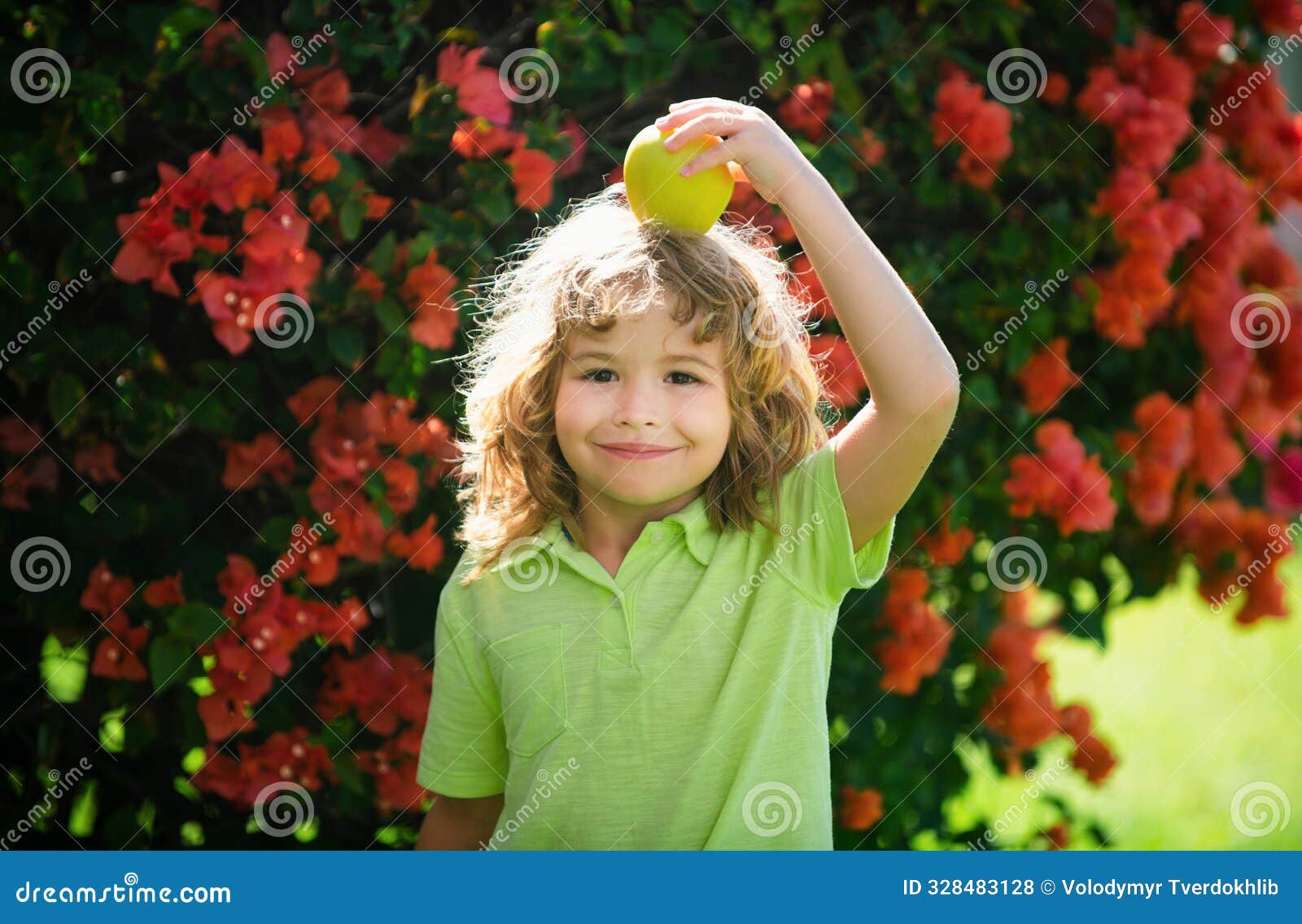 Little Child with Red Apple on Head Outdoor. Stock Photo - Image of ...
