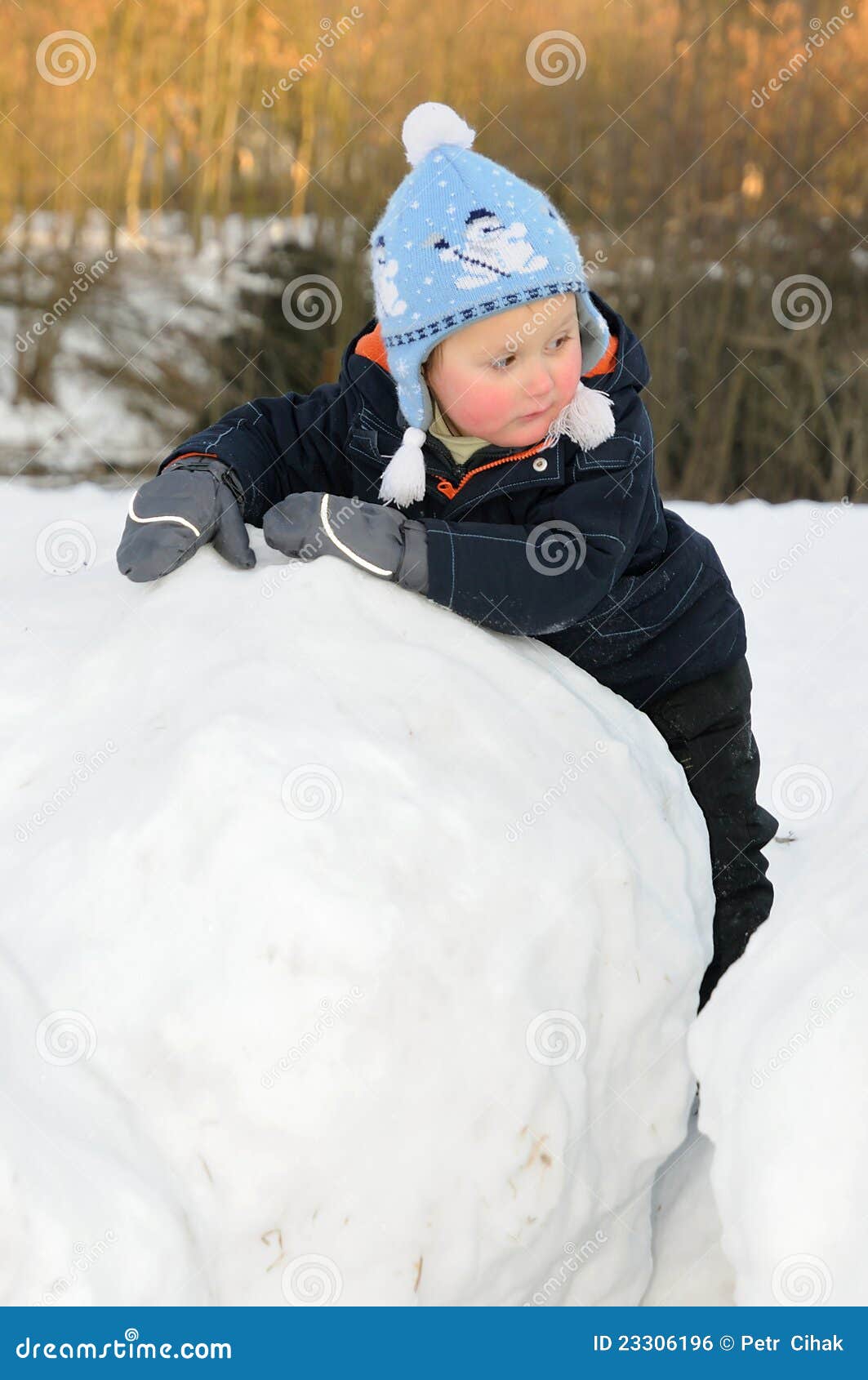 Little child on snowball stock photo. Image of active - 23306196