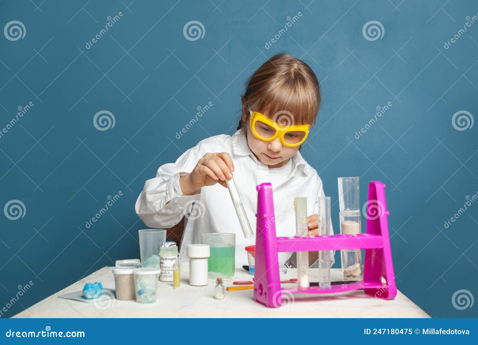 Little Child Student Doing a Chemical Experiment and Holding Flask in ...