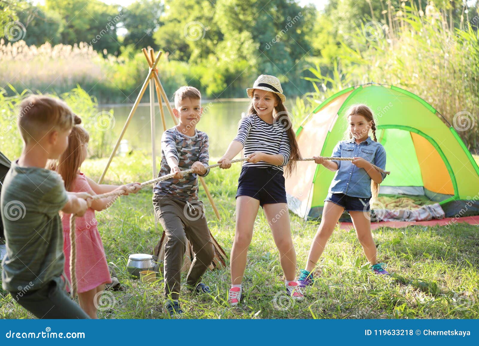 Little Children Pulling Rope Outdoors Stock Photo - Image of ...