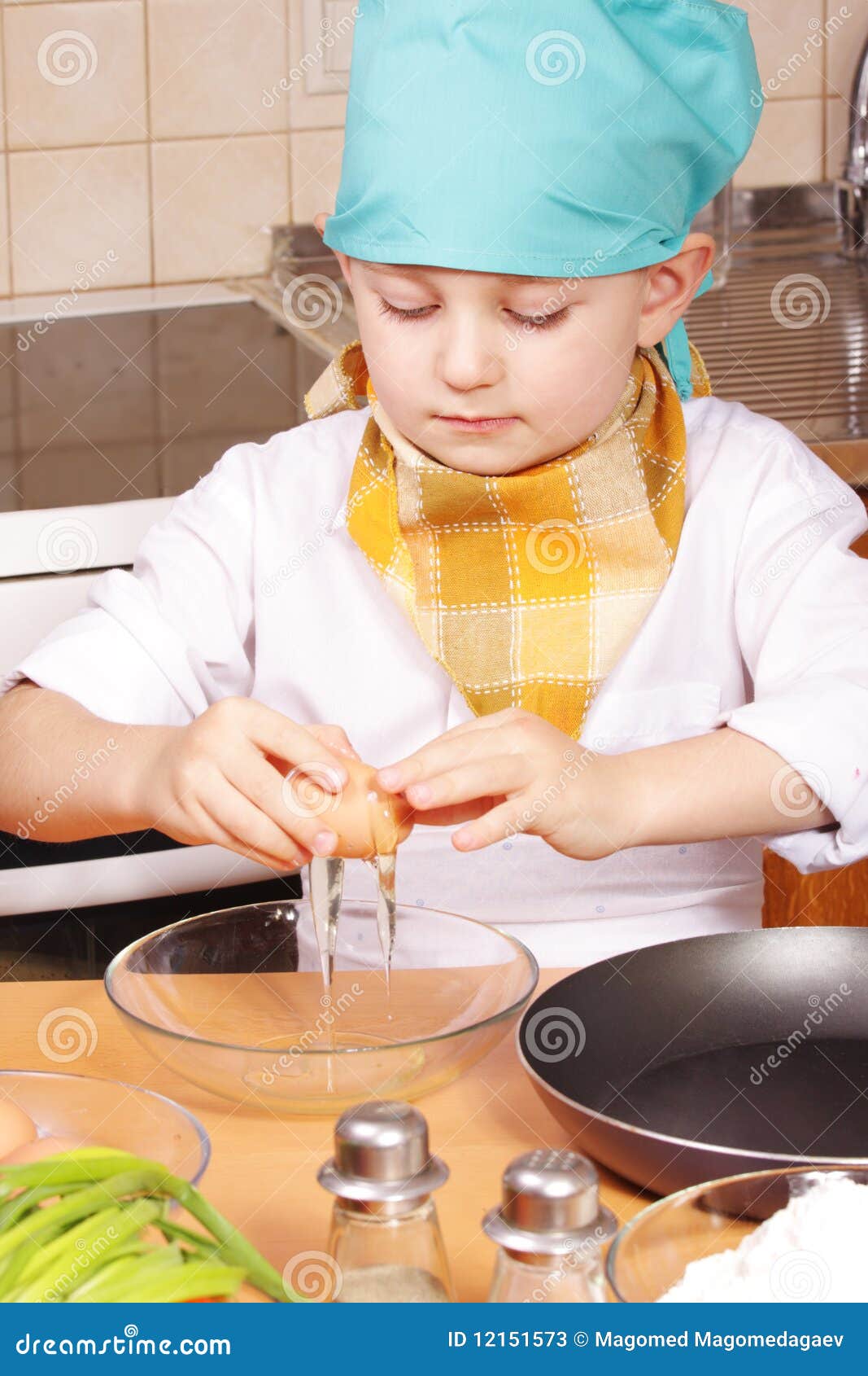Little cook breaking egg stock image. Image of bowl, vertical - 12151573