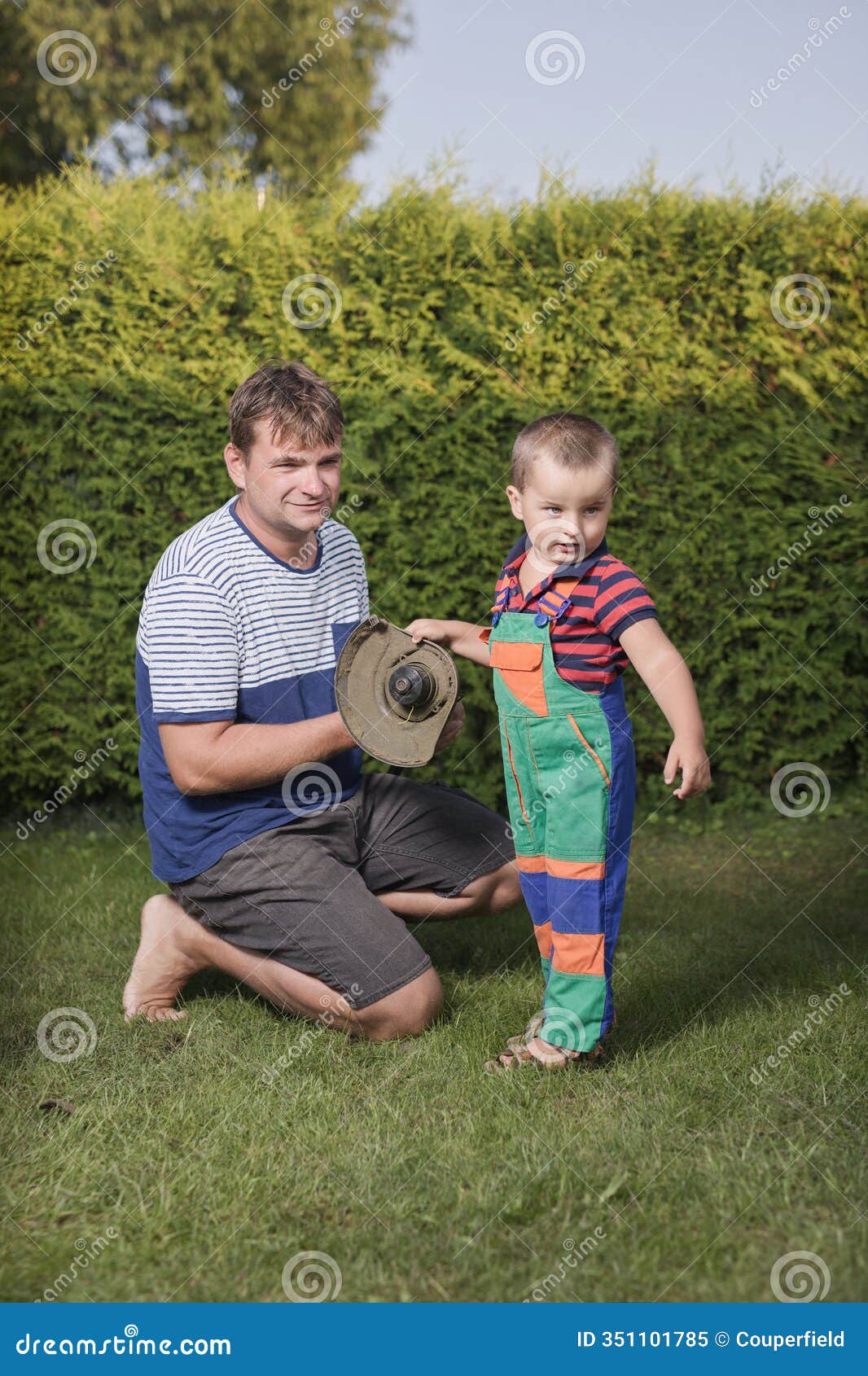 Little Craftsman with Father Using Several Power Tools in Garden Corner ...