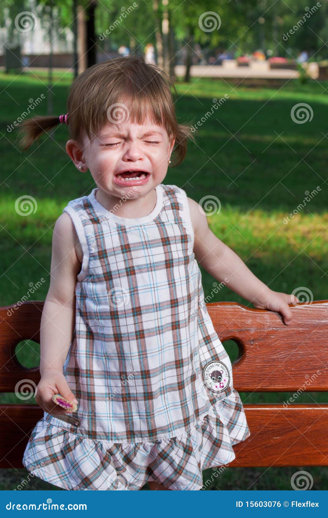 Little crying girl in park stock photo. Image of face - 15603076