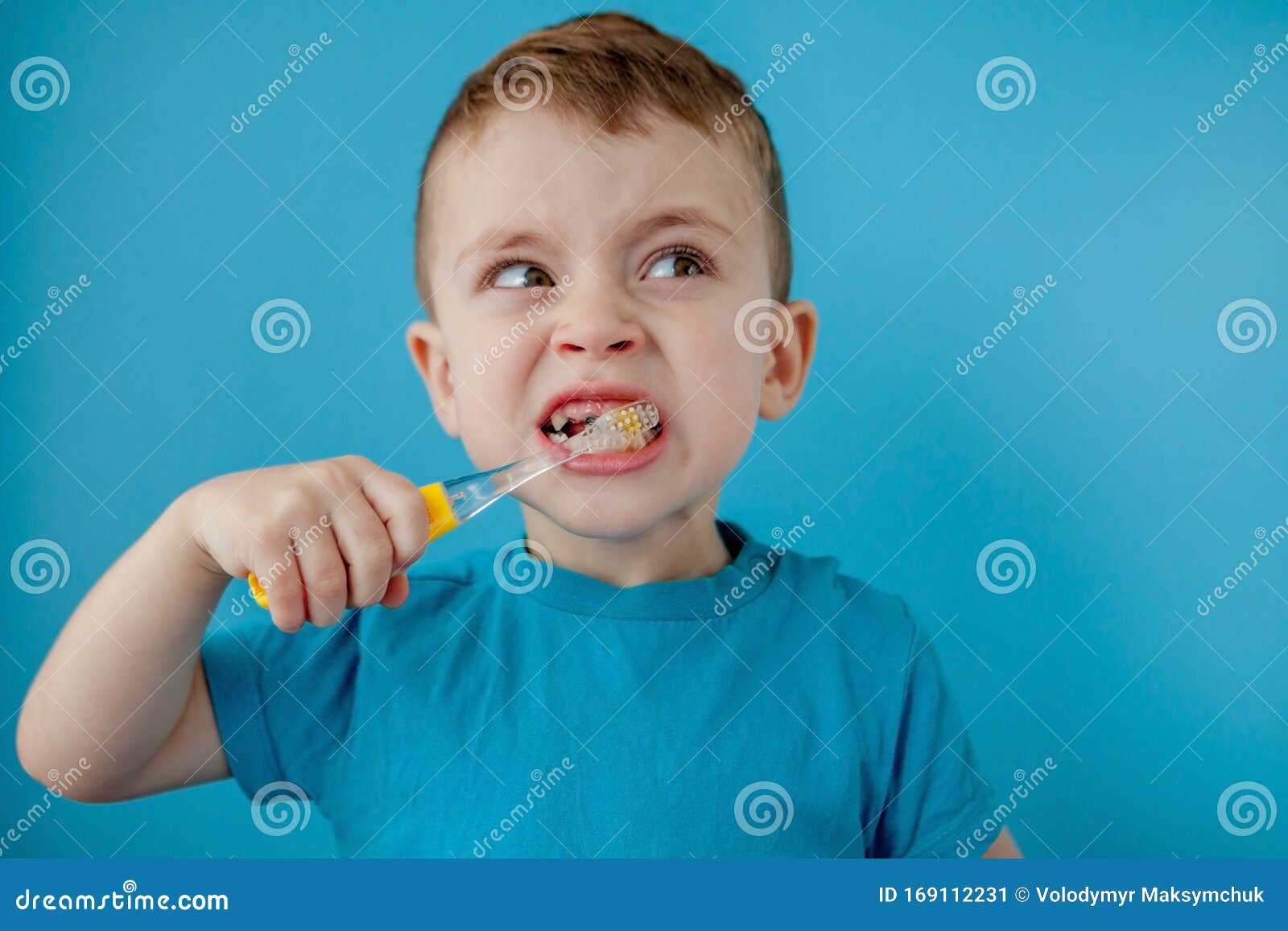 Little Cute Boy Brushing His Teeth on Blue Background Stock Image ...