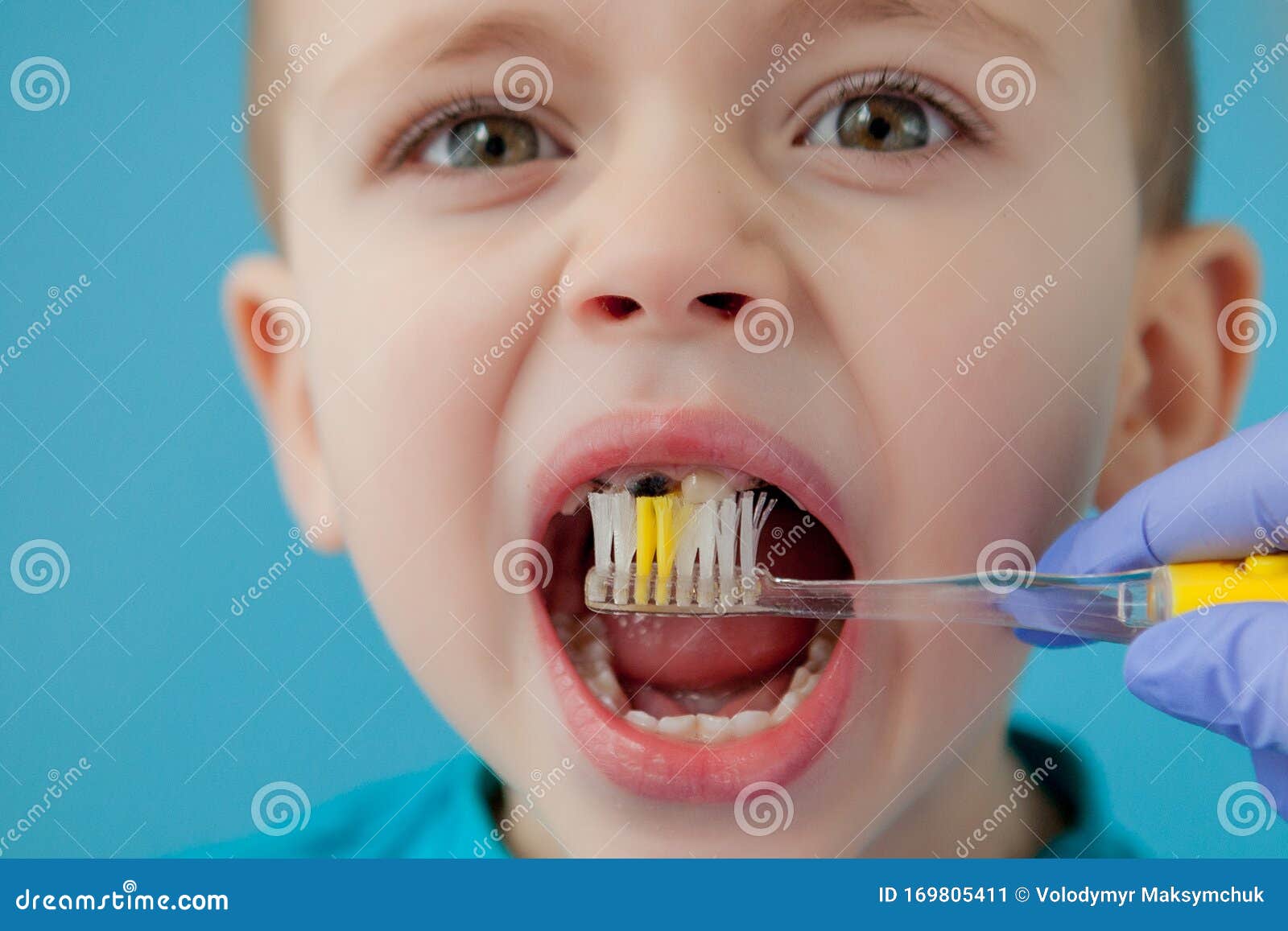 Little Cute Boy Brushing His Teeth on Blue Background Stock Image ...