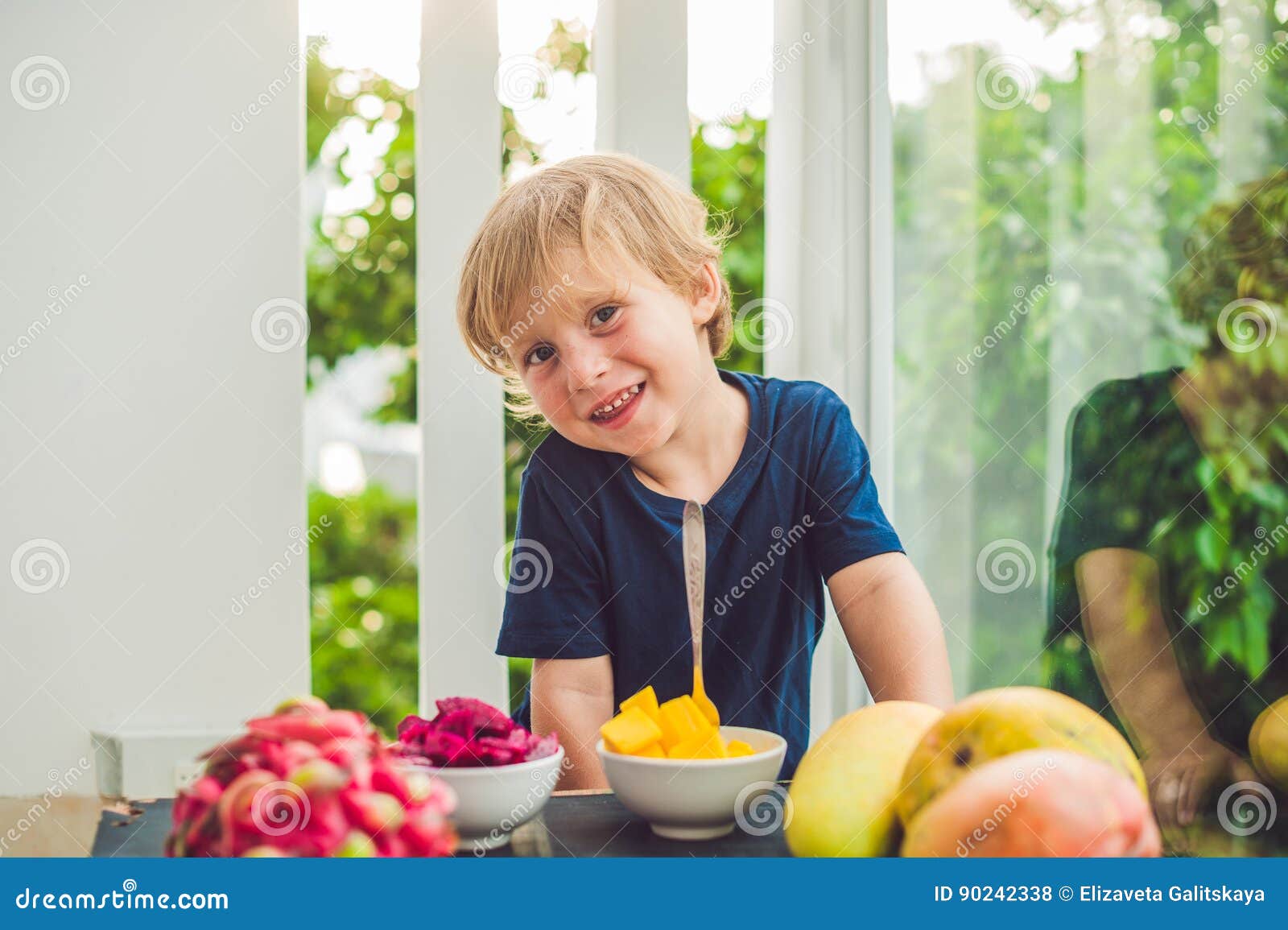 Little Cute Boy Eating Mango on the Terrace Stock Photo - Image of ...