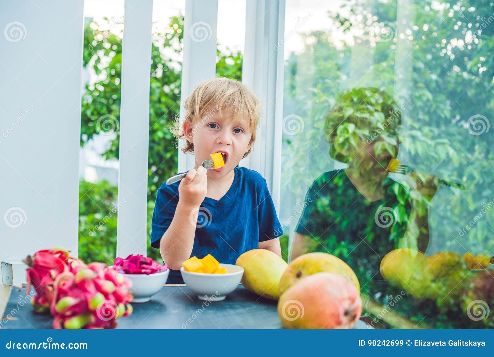 Little Cute Boy Eating Mango on the Terrace Stock Image - Image of ...